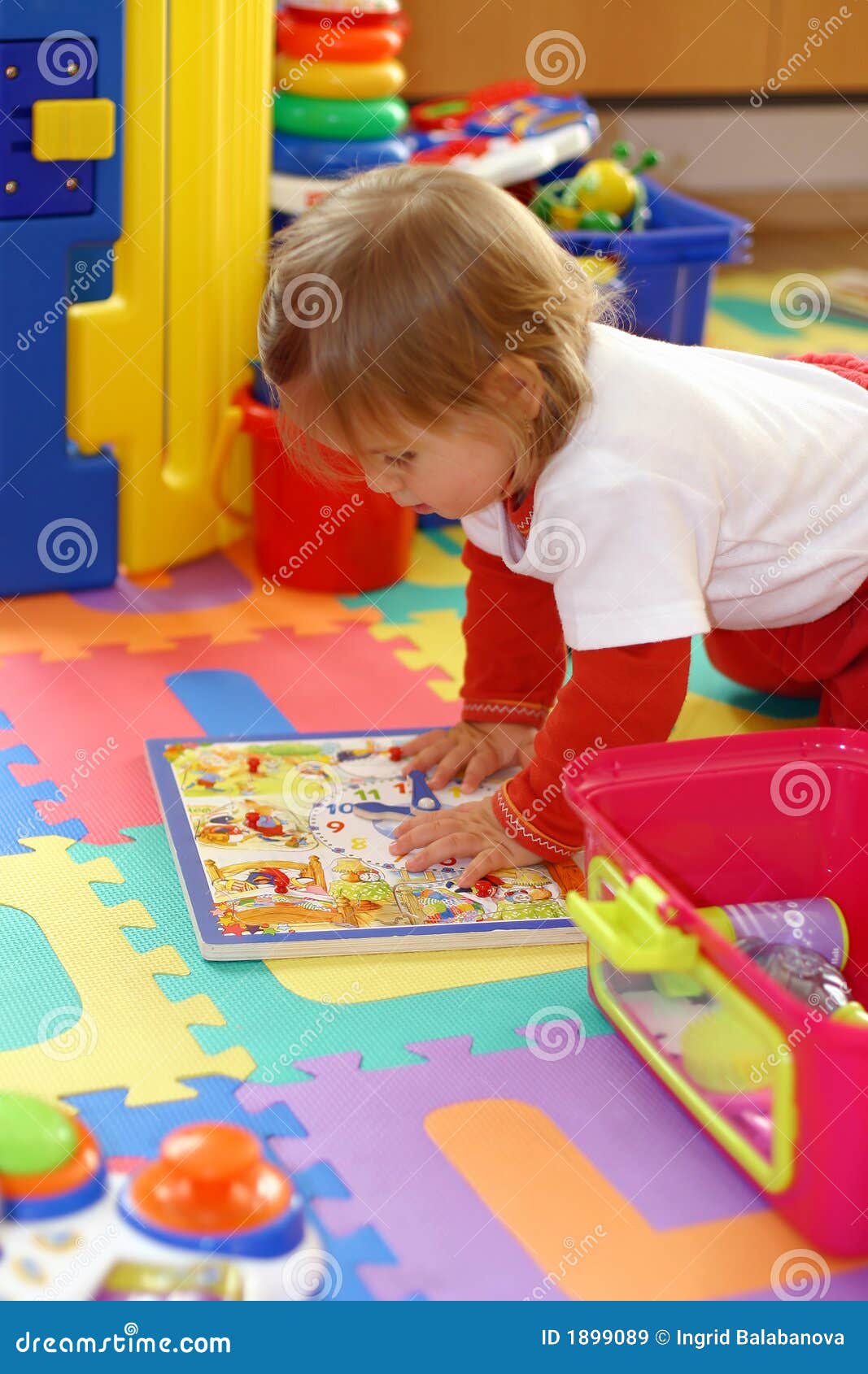 Baby playing with toys stock image. Image of families - 1899089