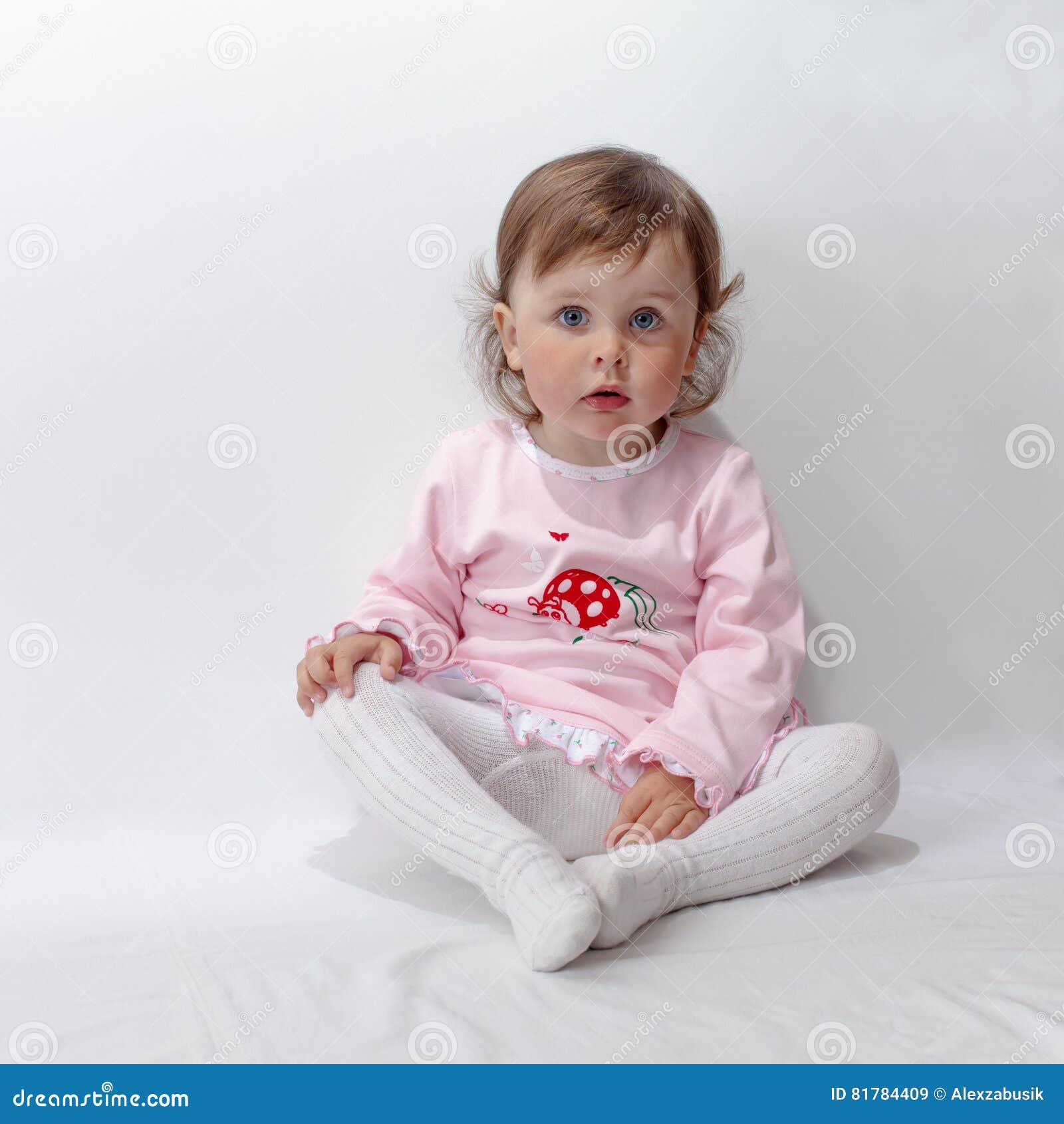 A Fat Baby Posing For The Camera While Working Down Stairs Stock ...