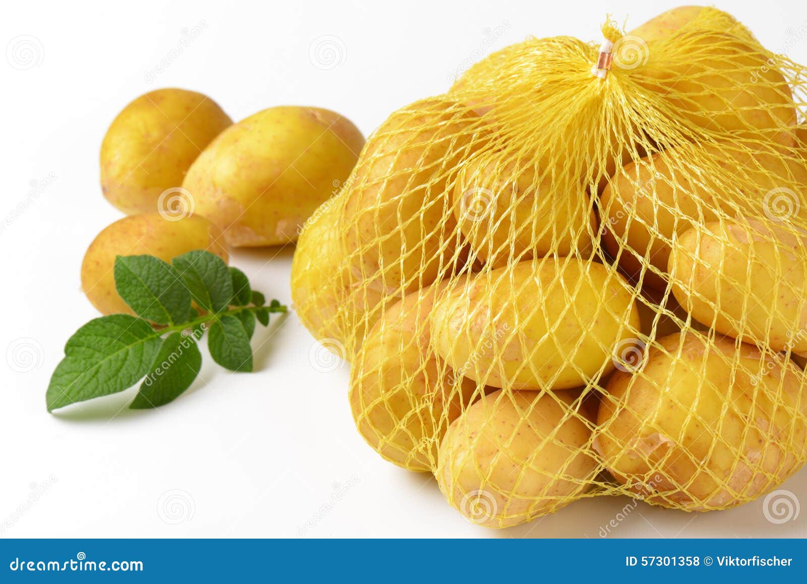 Baby potatoes in netting stock photo. Image of pile, healthy - 57301358