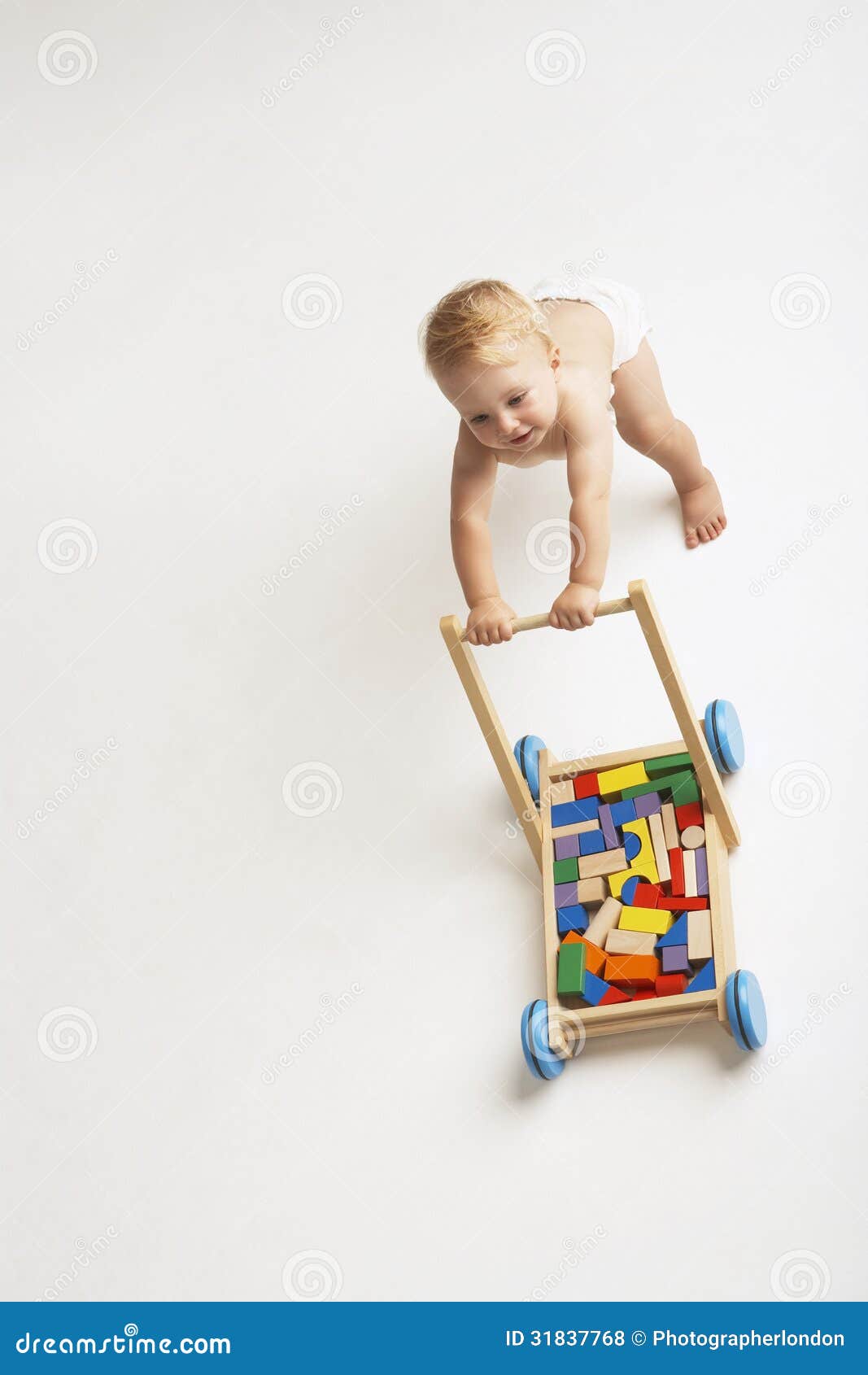 Baby Boy Pushing Cart Full Of Wooden Blocks Royalty-Free Stock Image ...