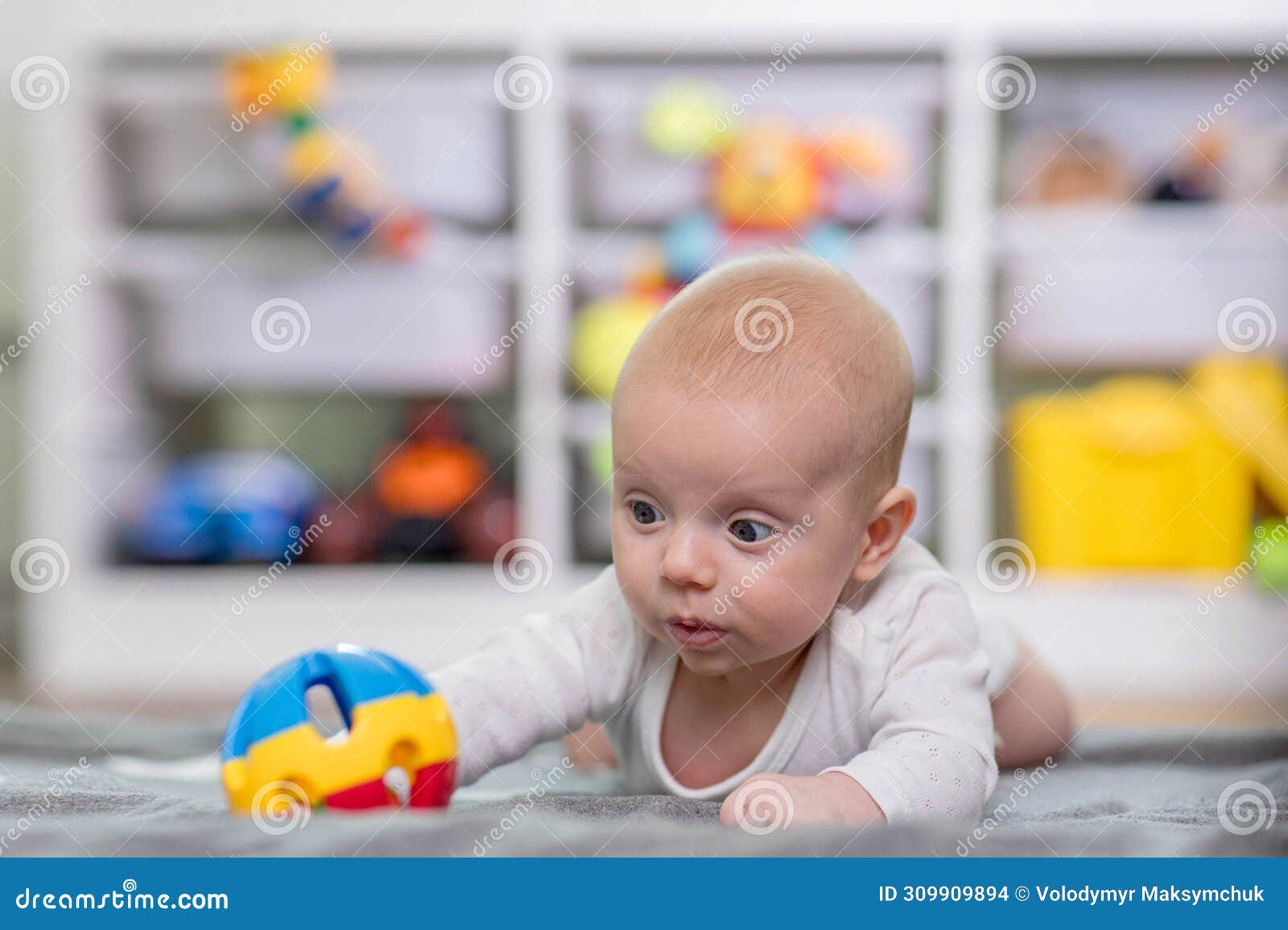 Baby Reaching for Toy. Baby Development Stock Photo - Image of lovely ...