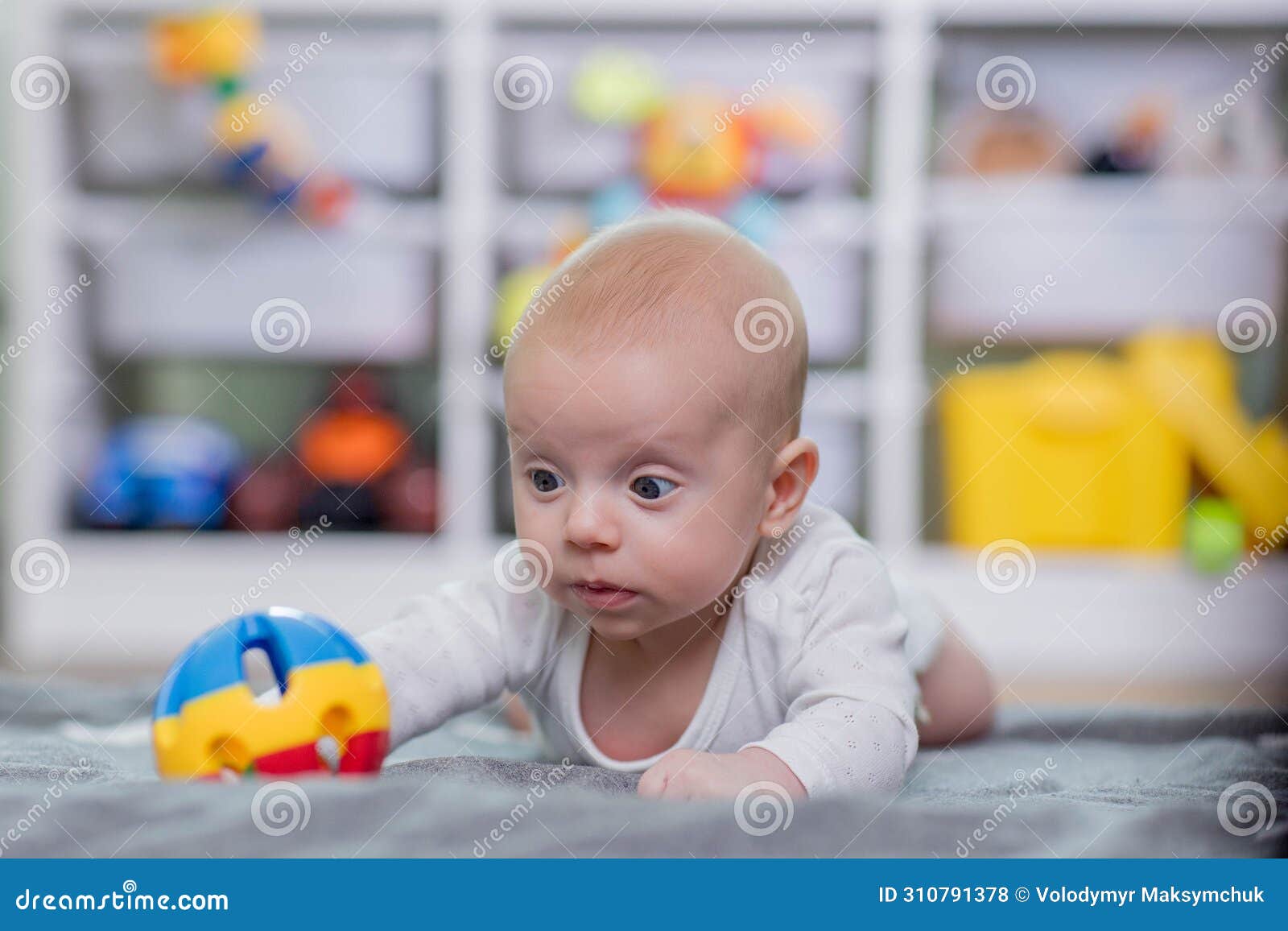 Baby Reaching for Toy. Baby Development Stock Photo - Image of reaching ...