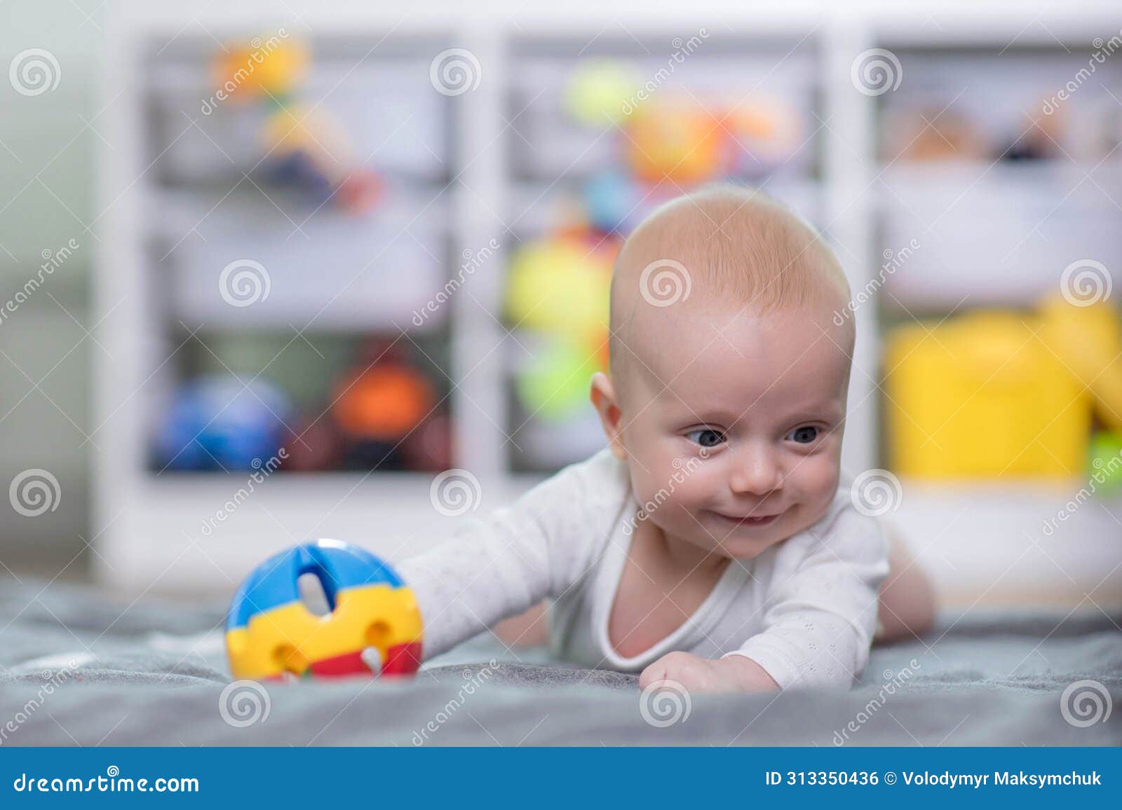 Baby Reaching for Toy. Baby Development Stock Photo - Image of ...