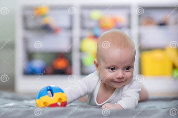 Baby Reaching for Toy. Baby Development Stock Photo - Image of ...
