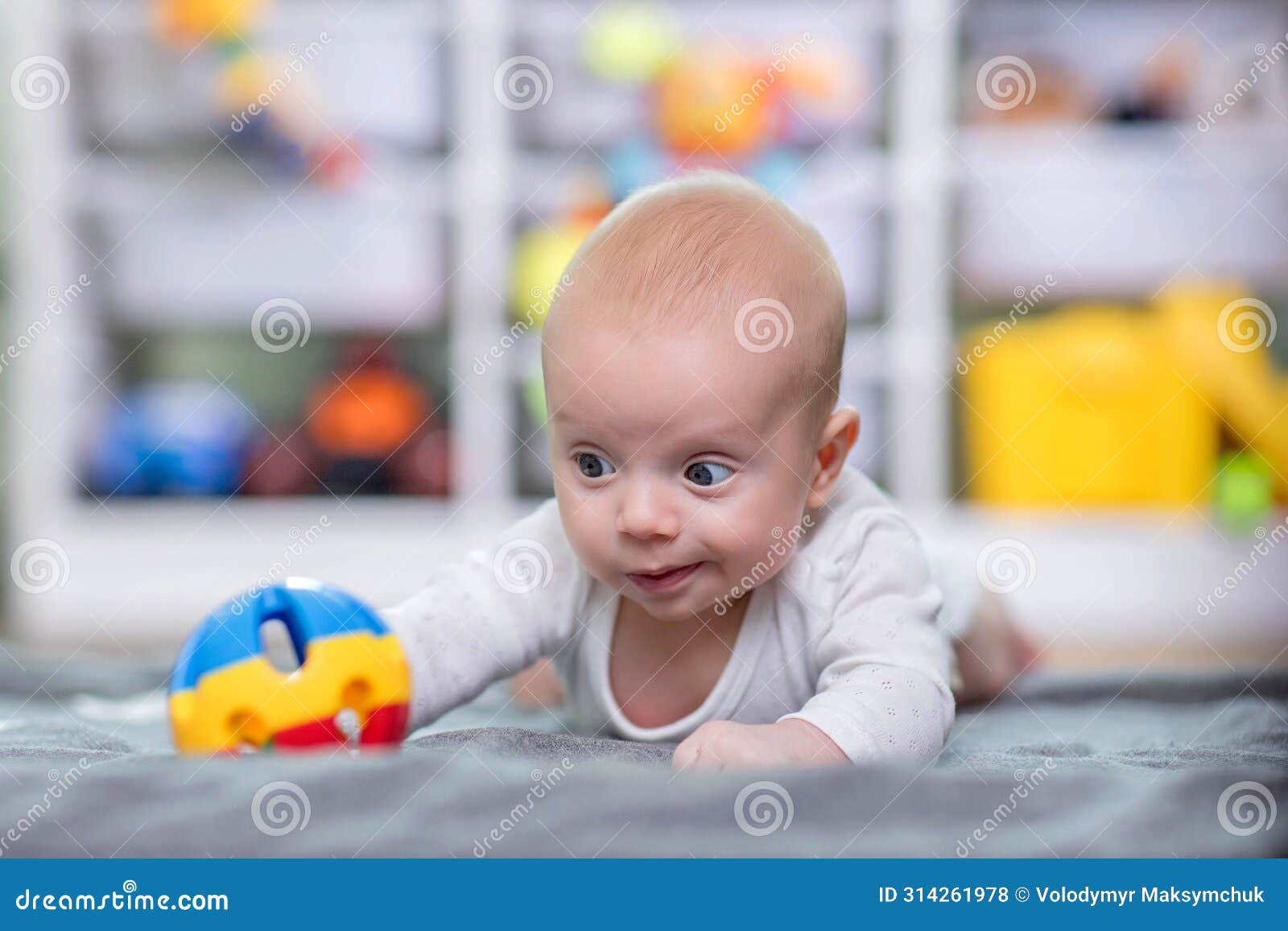 Baby Reaching for Toy. Baby Development Stock Photo - Image of innocent ...