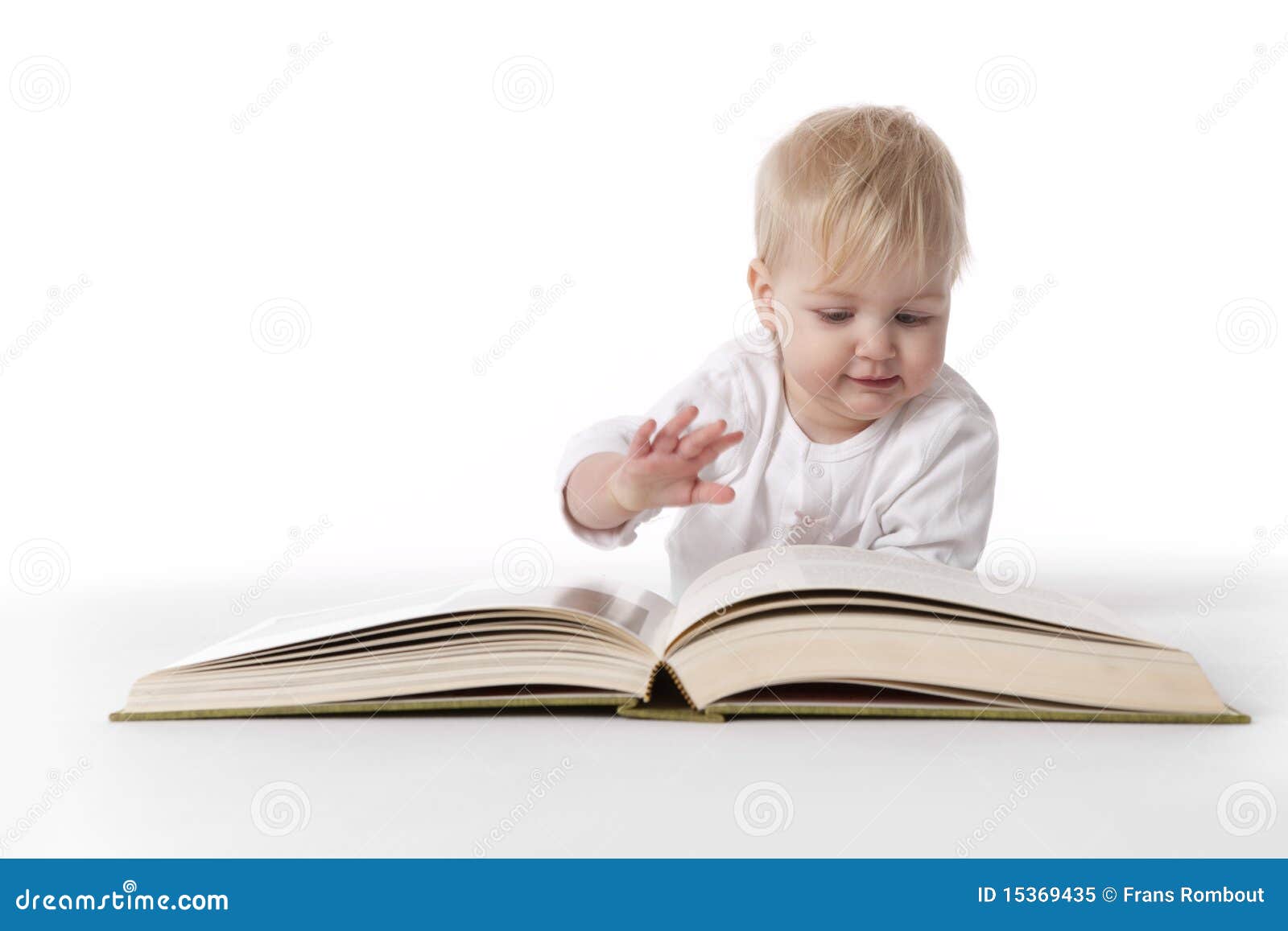 Baby reads a large book stock image. Image of book, pretend - 15369435
