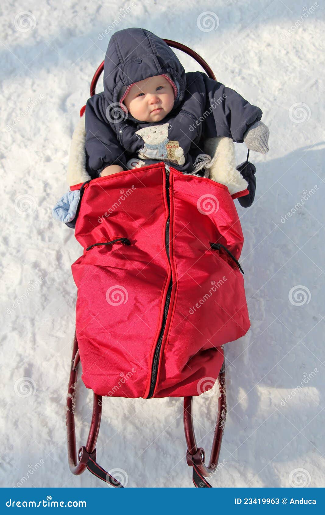 Baby in red sledge stock image. Image of family, walk - 23419963