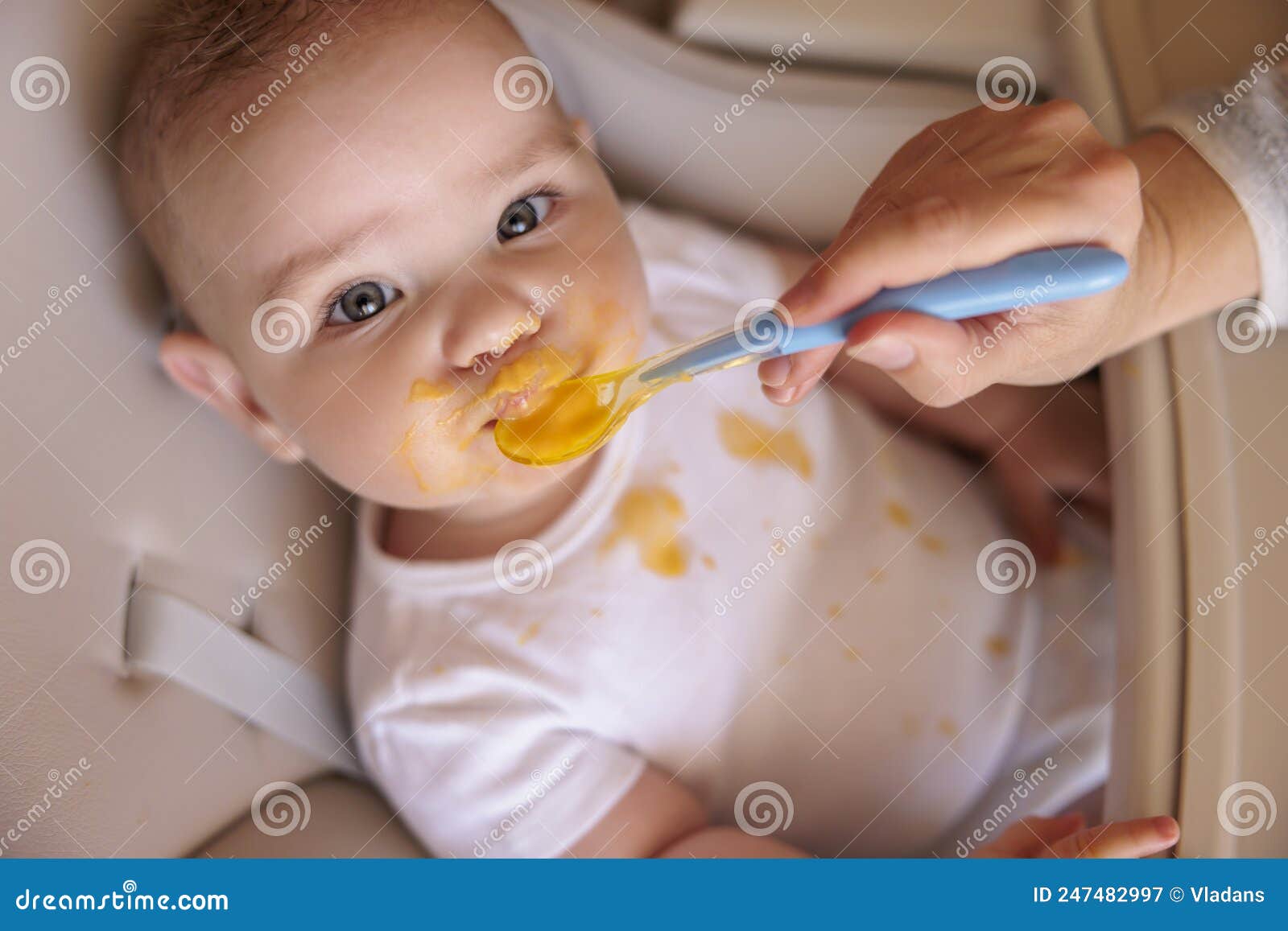 Baby Refusing Food while Mother Feeding Him Stock Image - Image of ...