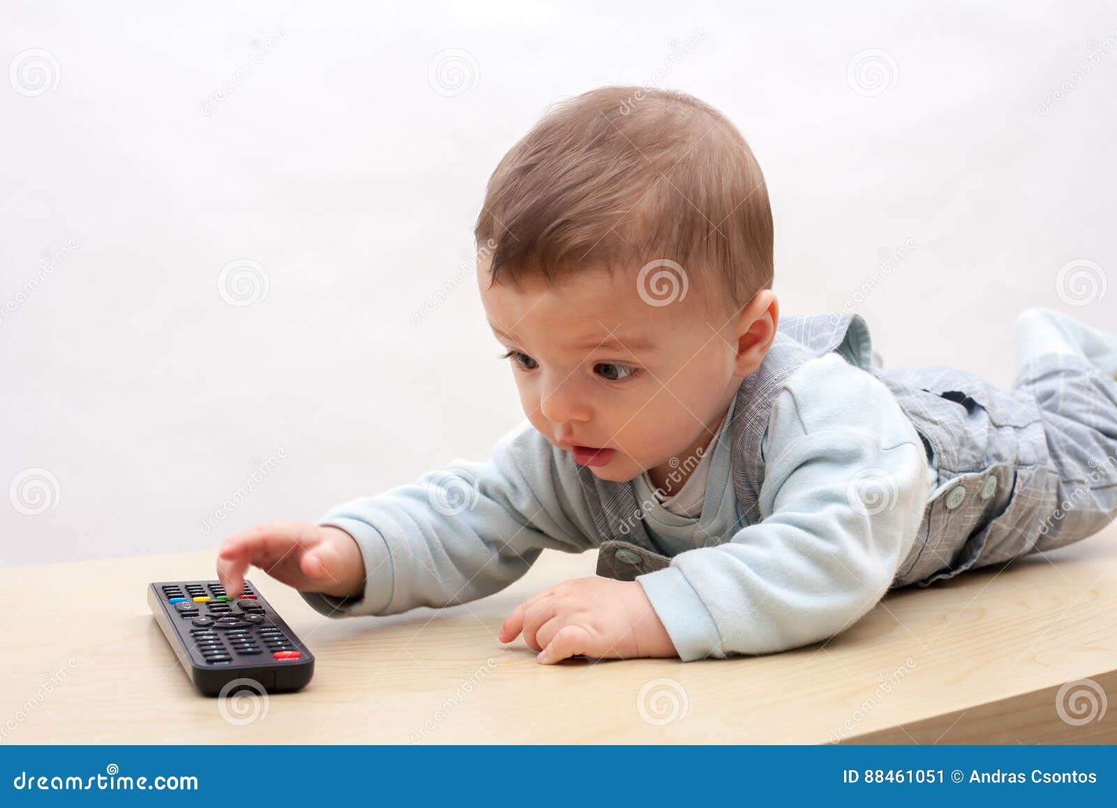 Baby and the Remote Control Stock Image - Image of remote, smiling ...