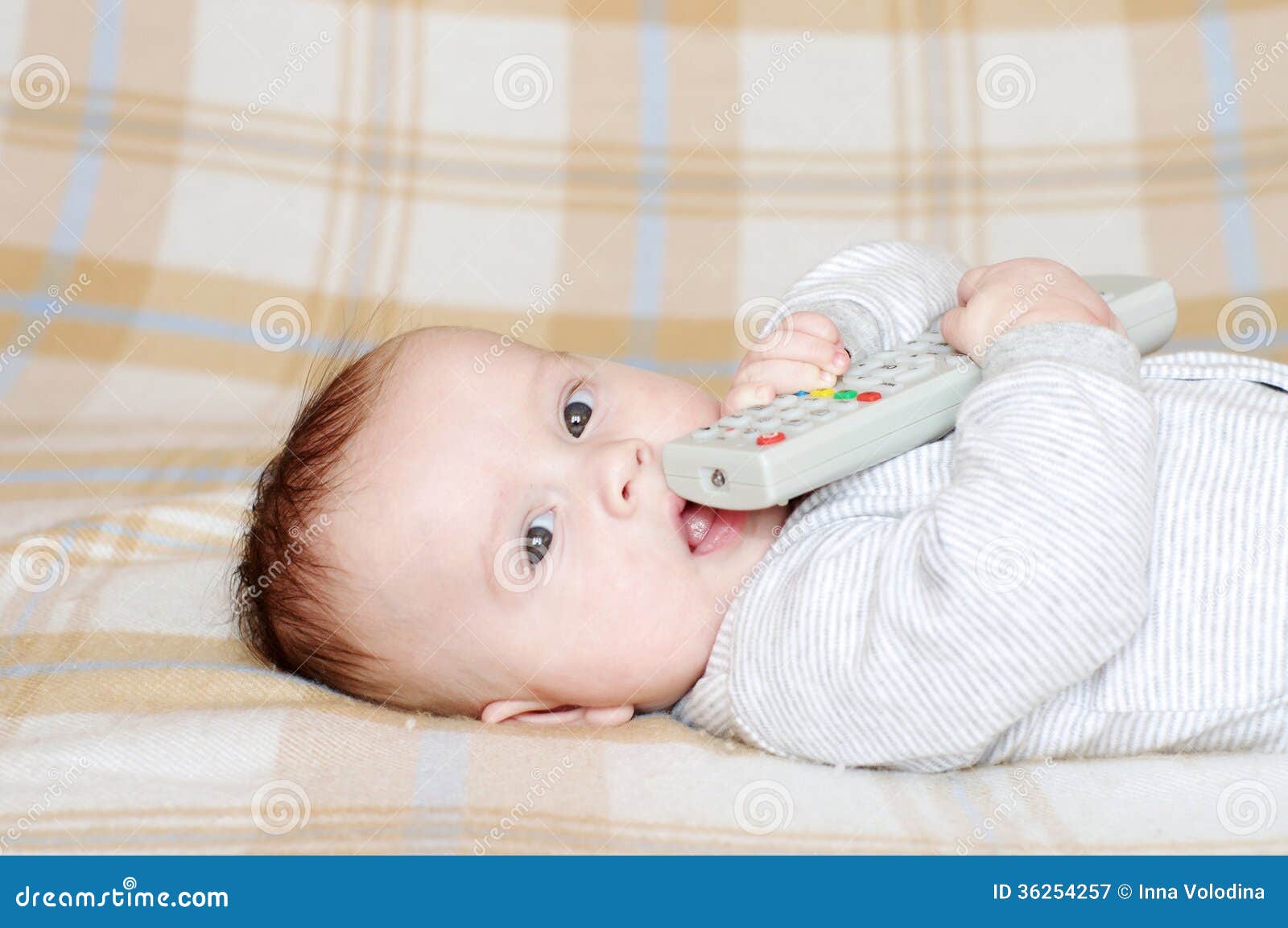 Baby with remote control stock image. Image of children - 36254257