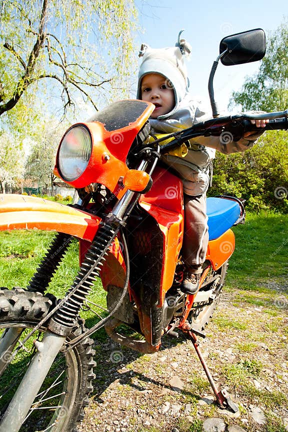 Baby riding motorcycle stock image. Image of outdoors - 20138157