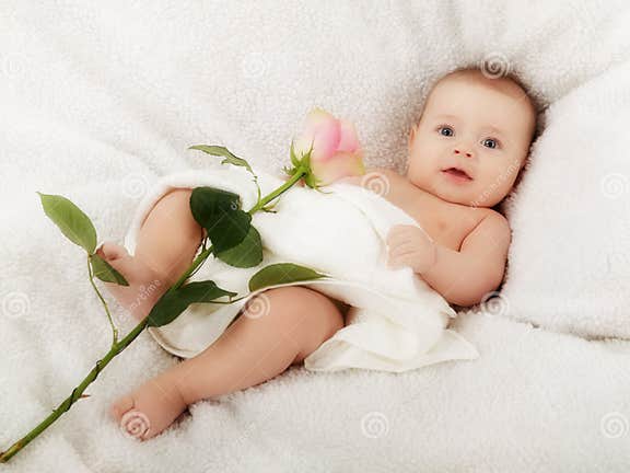 Baby with rose stock image. Image of flower, face, smiling - 19352133