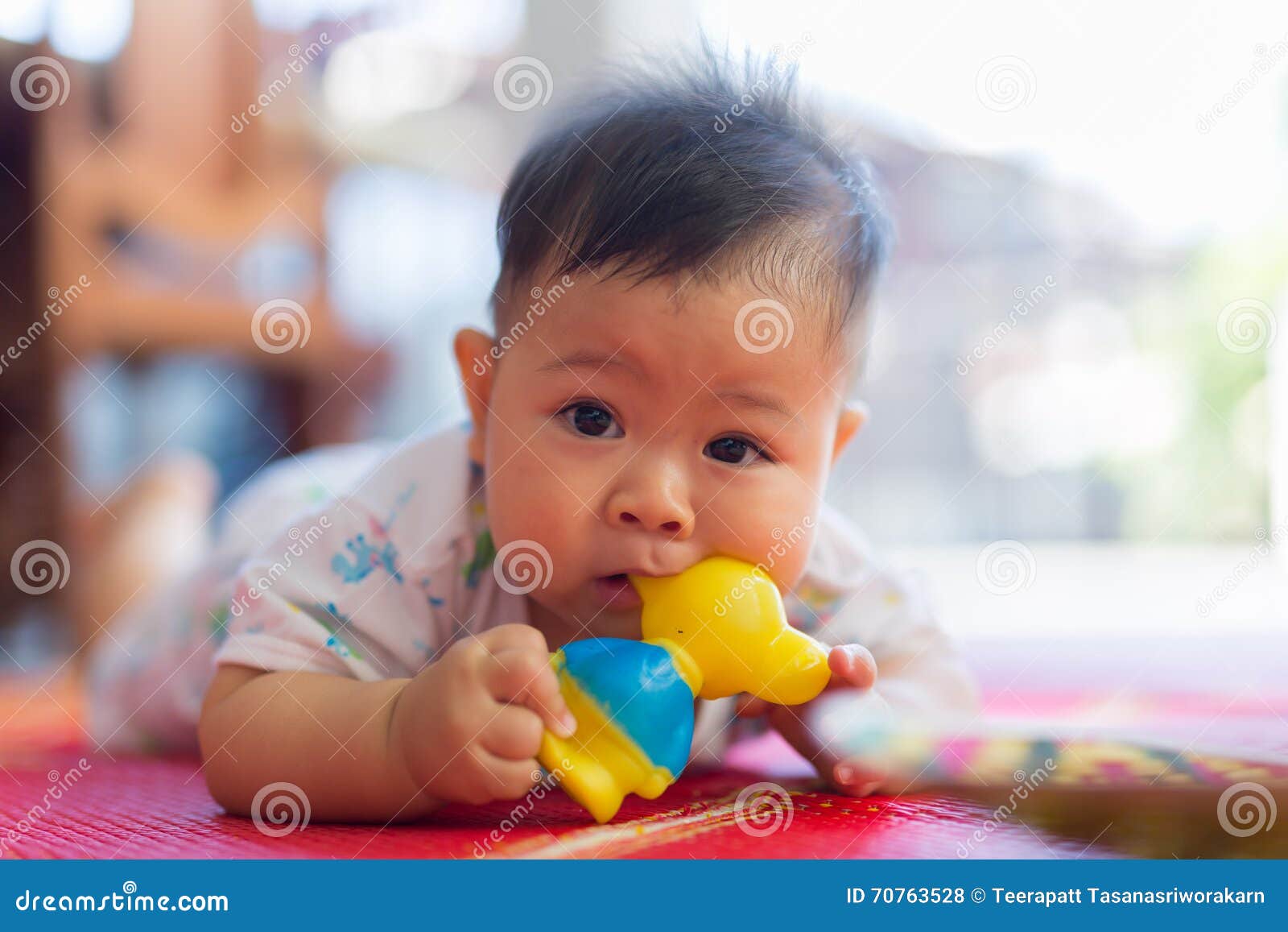 Baby and the rubber toy stock photo. Image of cute, people - 70763528
