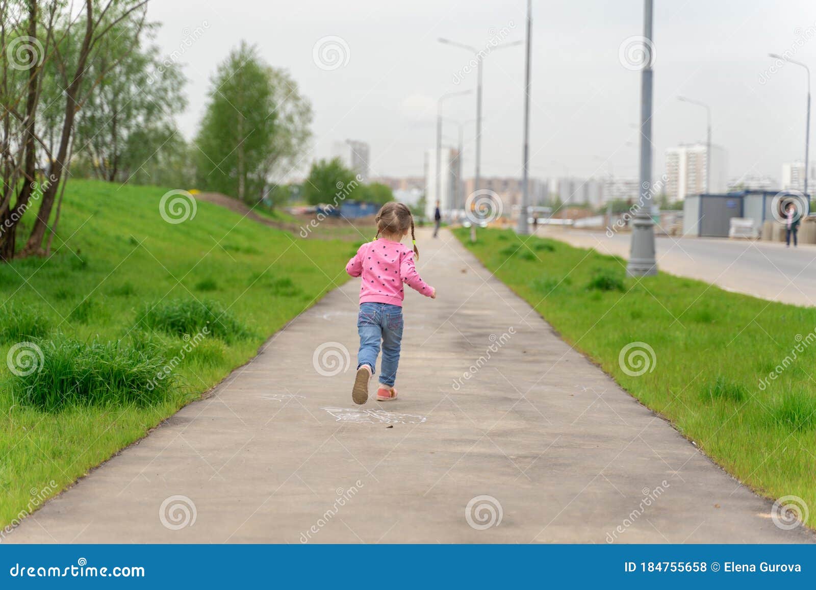 Baby runs on the road stock photo. Image of nature, away - 184755658