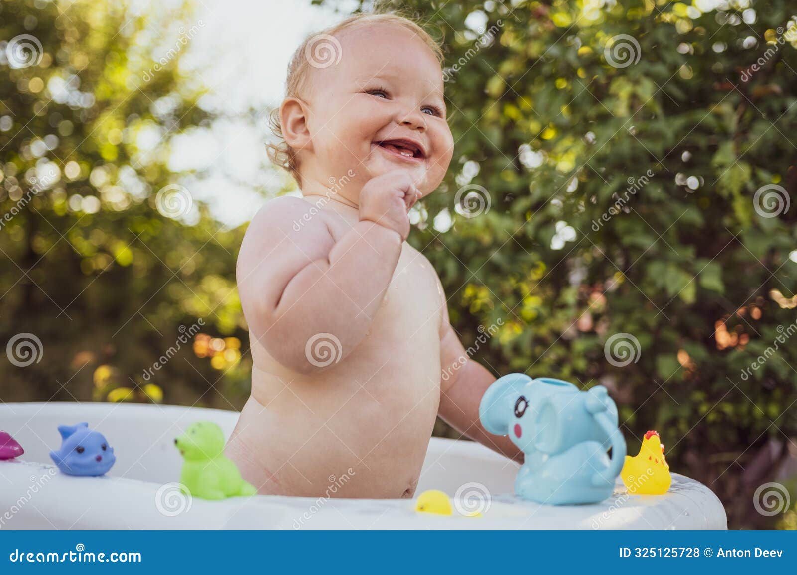A Baby S Delightful Bubble Bath Adventure in the Summer Sun Stock Photo ...