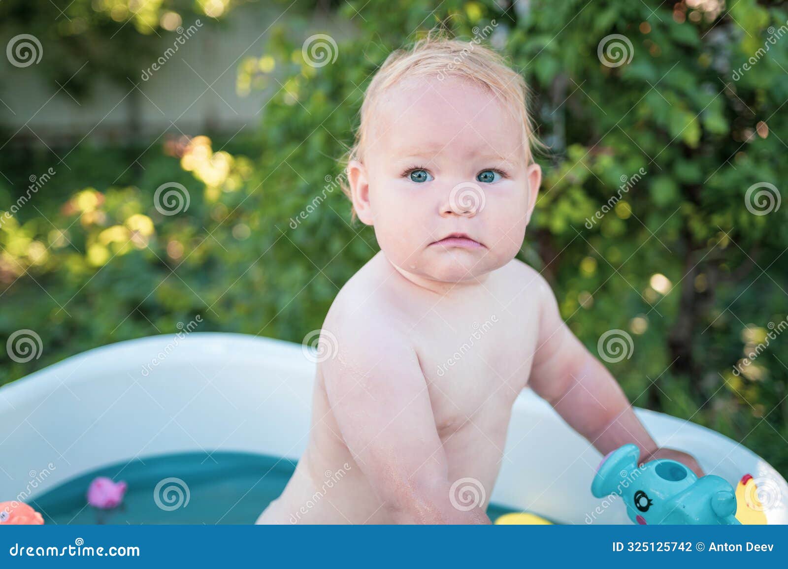 A Baby S Delightful Bubble Bath Adventure in the Summer Sun Stock Photo ...