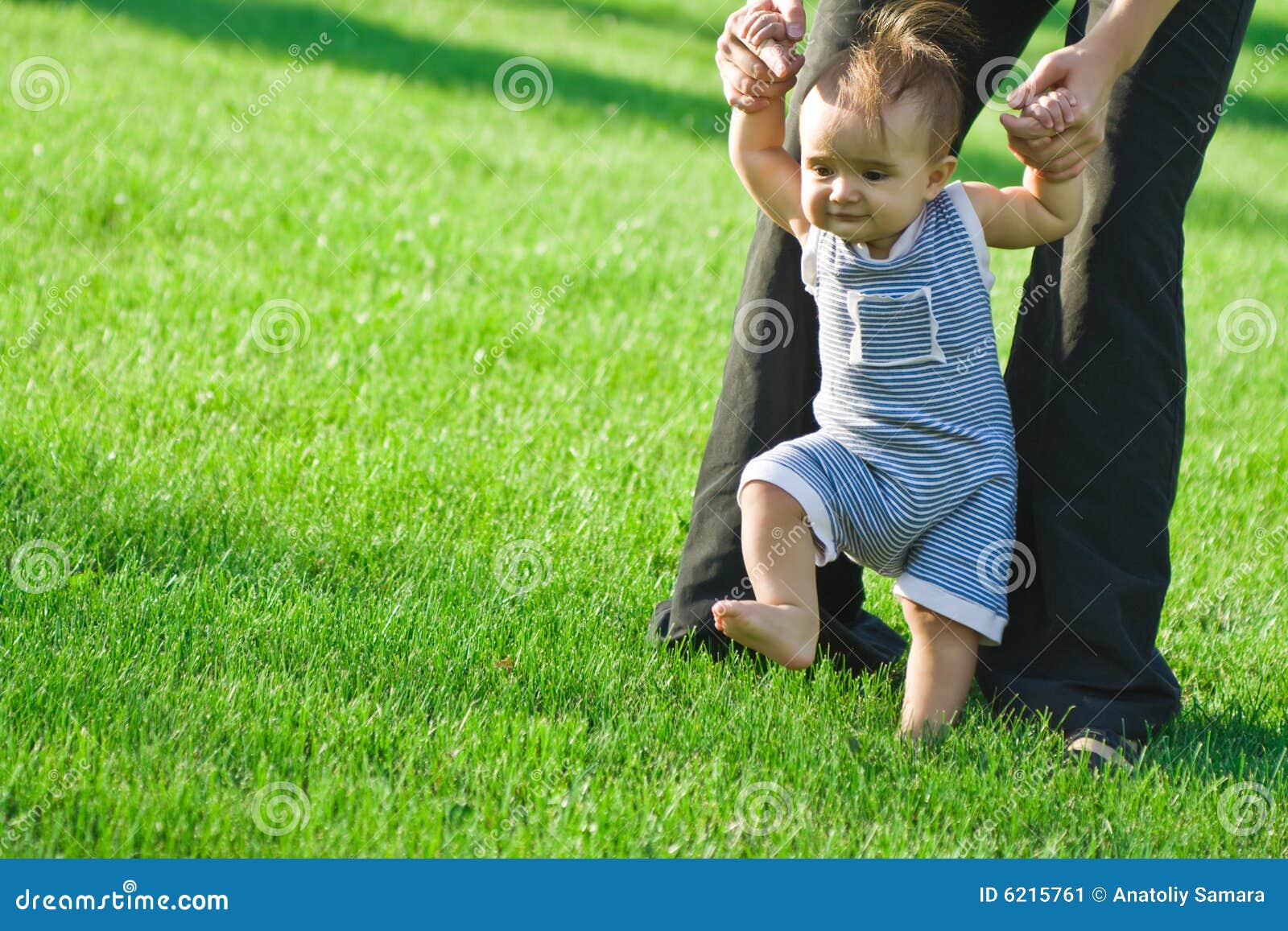 Baby s first steps stock image. Image of blue, hands, interacting - 6215761