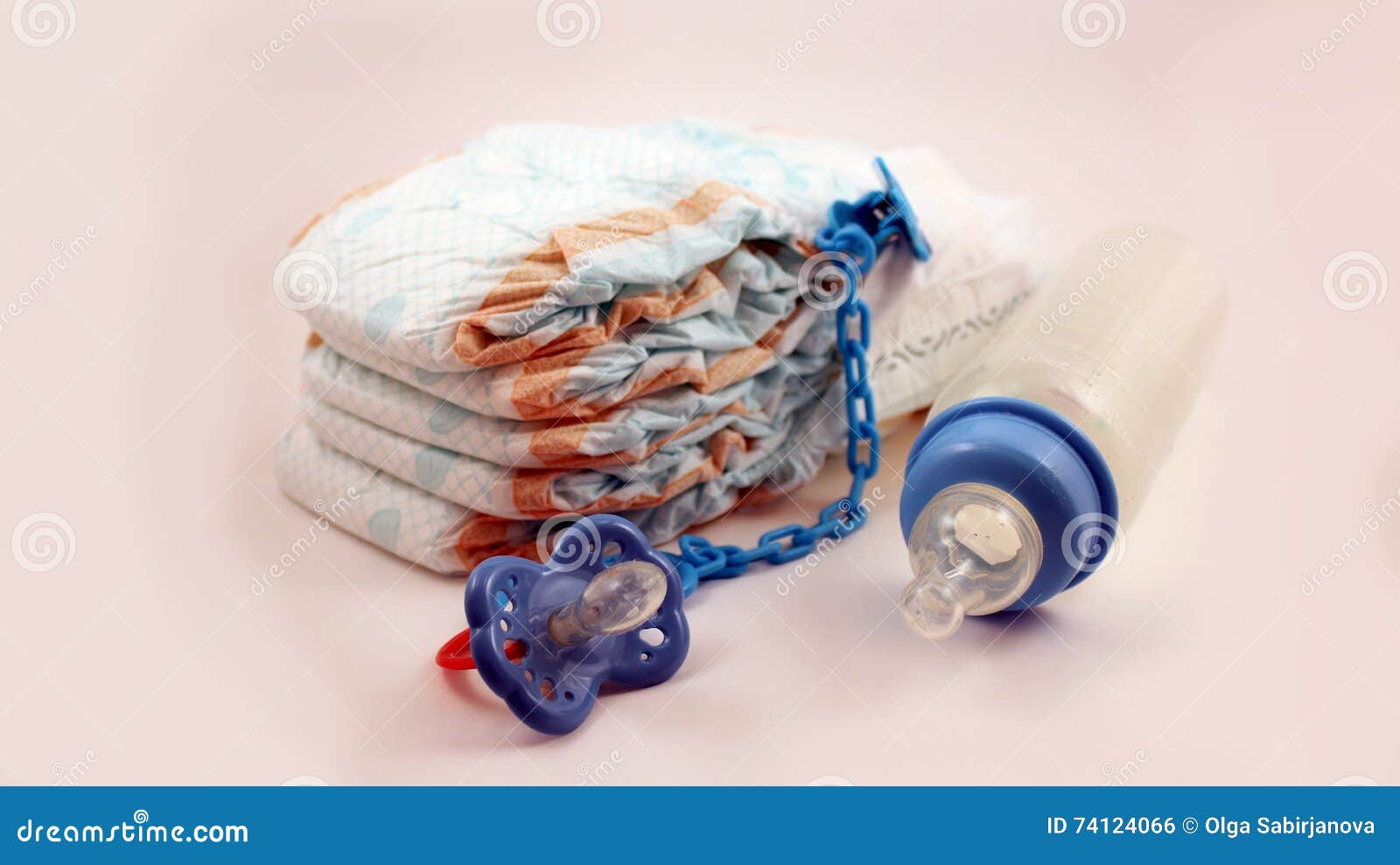 Baby S Pacifier and Stack of Diapers Stock Photo - Image of disposable ...