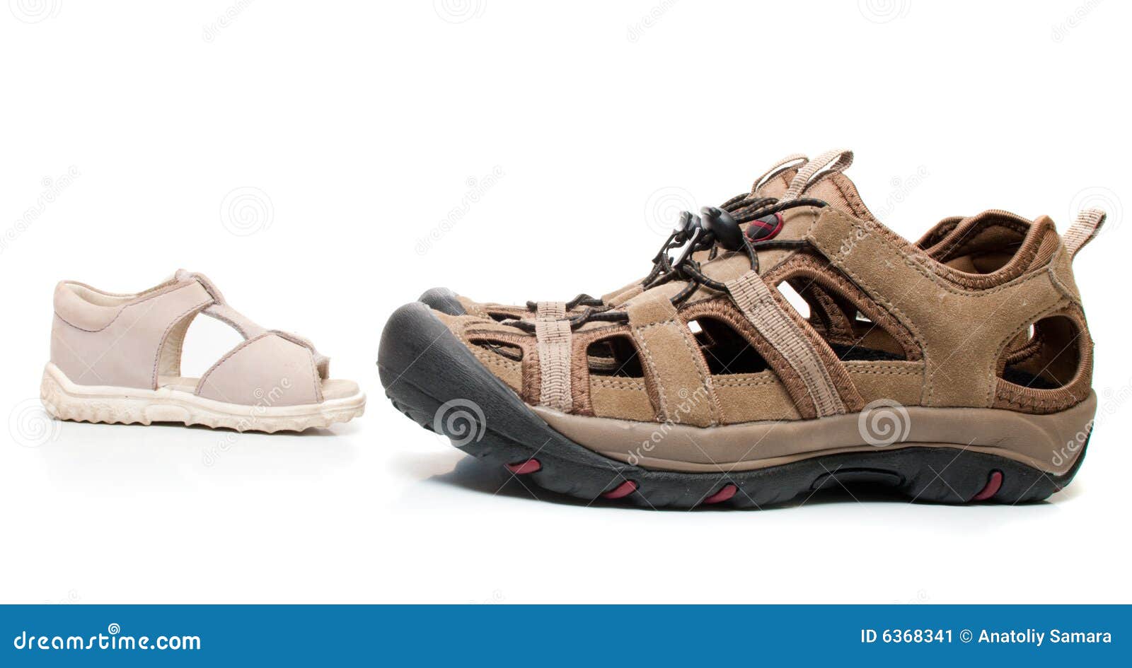 Baby Sandals Standing Opposite Male Shoes, Isolate Stock Image - Image ...