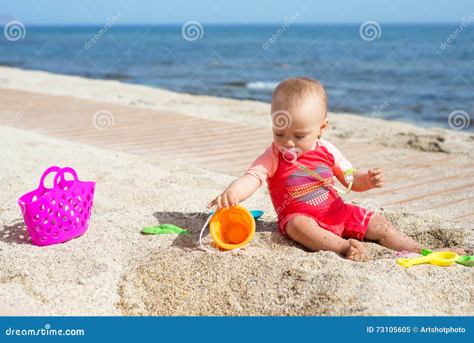 Baby at the seaside stock image. Image of recreation - 73105605