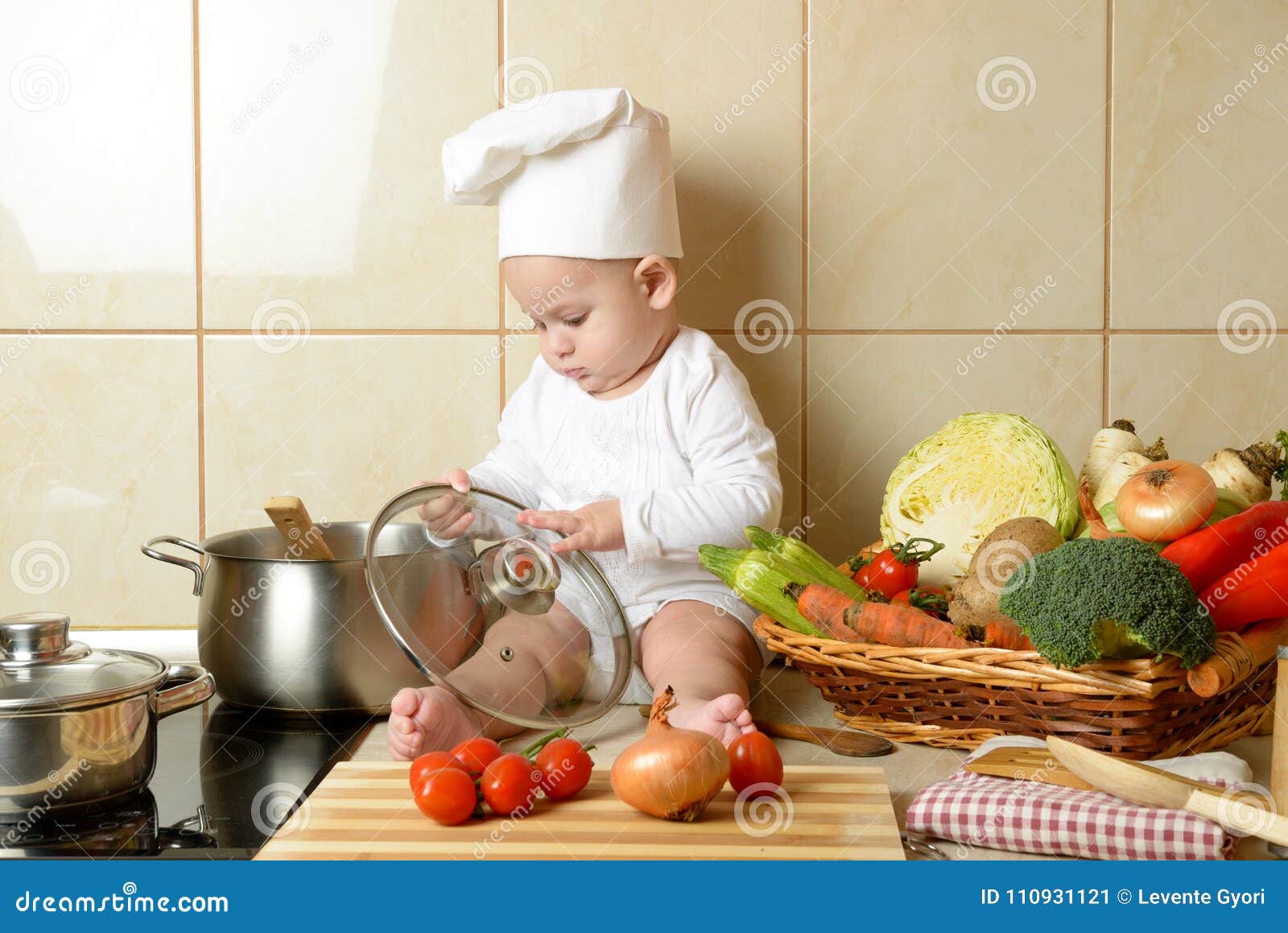Baby shef in the kitchen stock image. Image of cook - 110931121