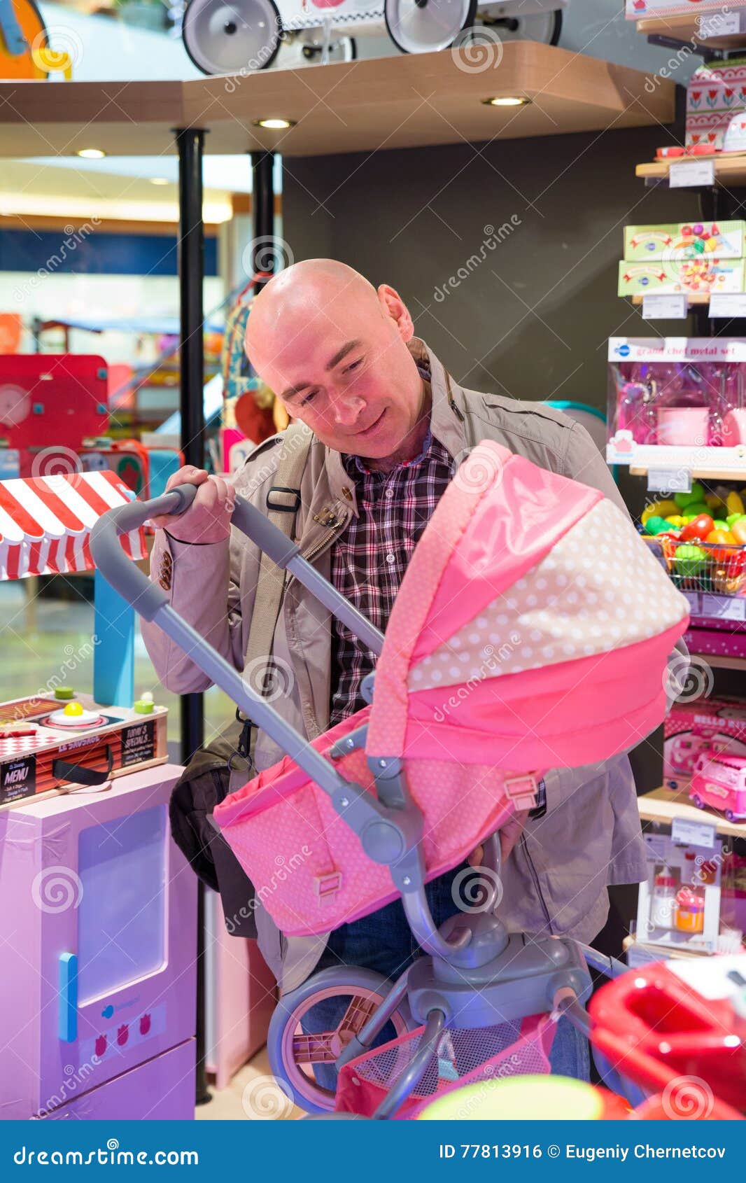 Baby shop buying stroller stock photo. Image of person - 77813916