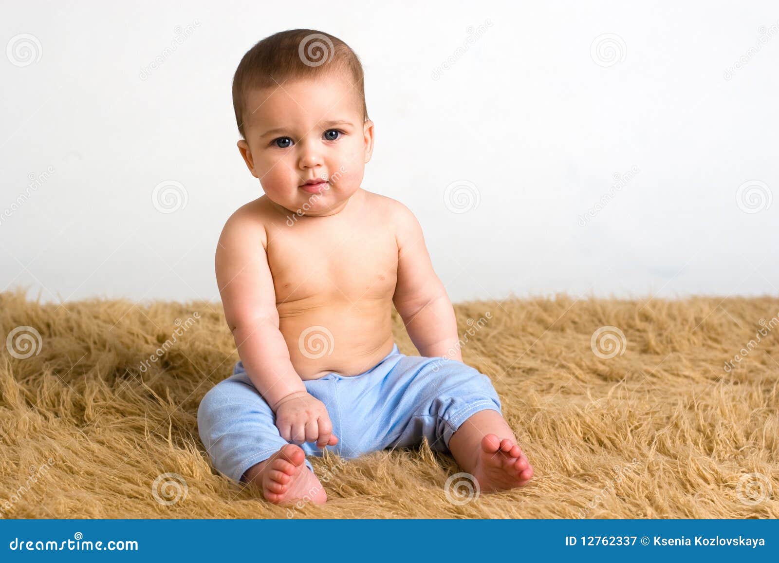 Baby sits on carpet stock image. Image of rattle, clear - 12762337
