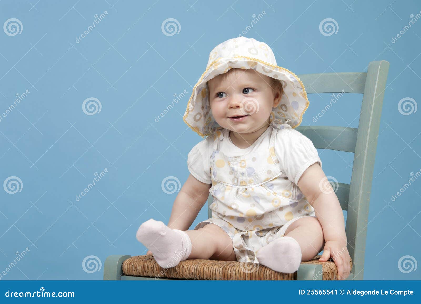 Baby sitting on a chair stock image. Image of toddler - 25565541