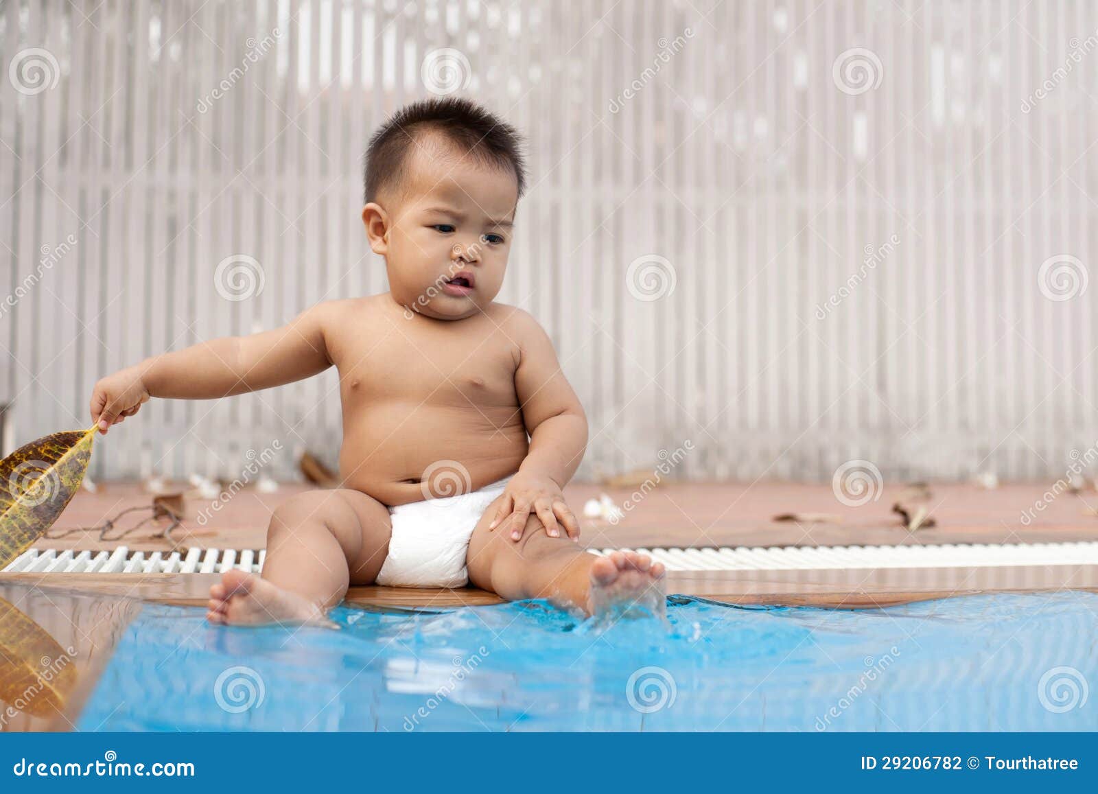 Baby Sitting Side of the Pool Stock Photo - Image of smiling, angelic ...