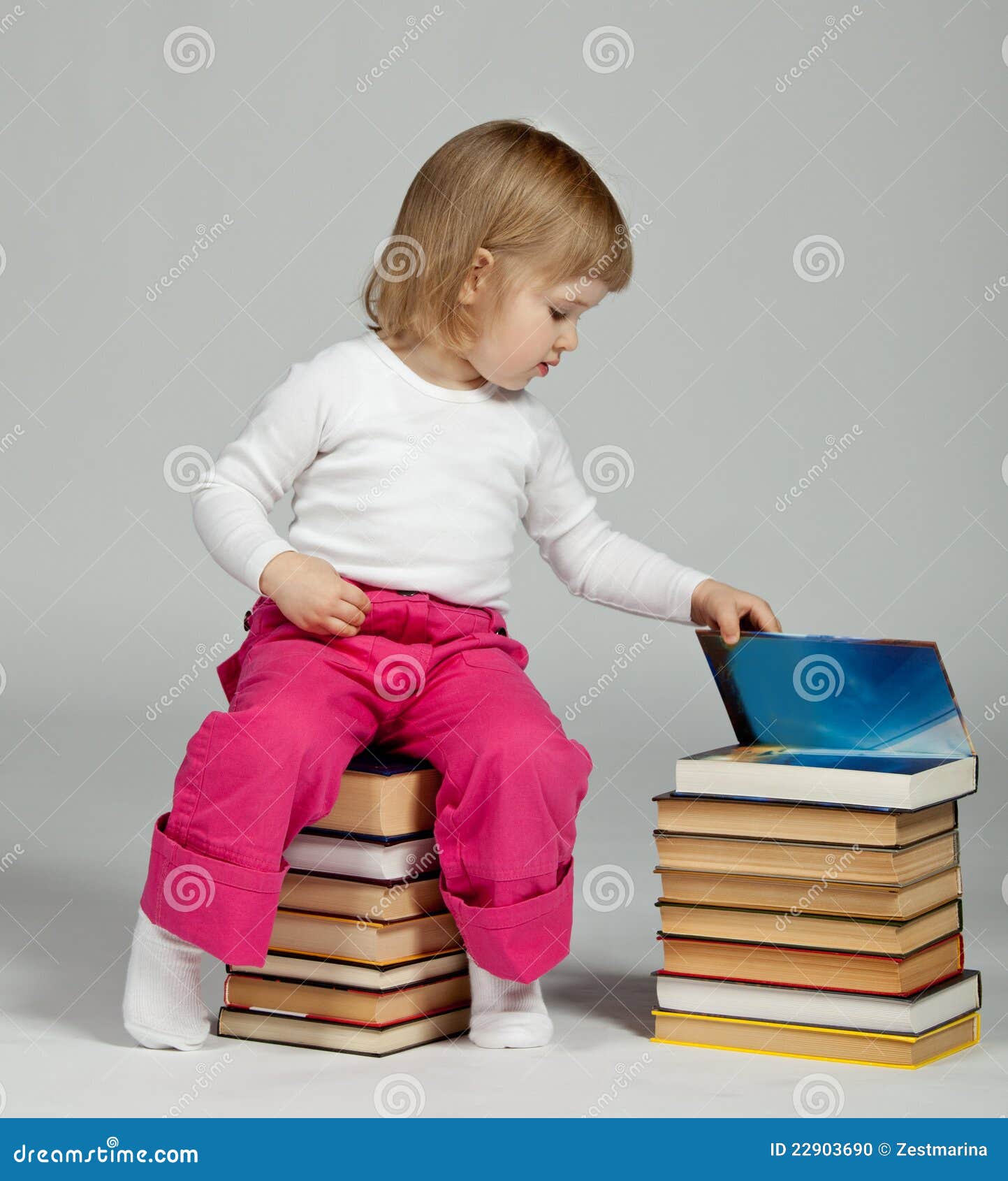 Baby Sitting on Stacked Books Stock Photo - Image of sitting, play ...