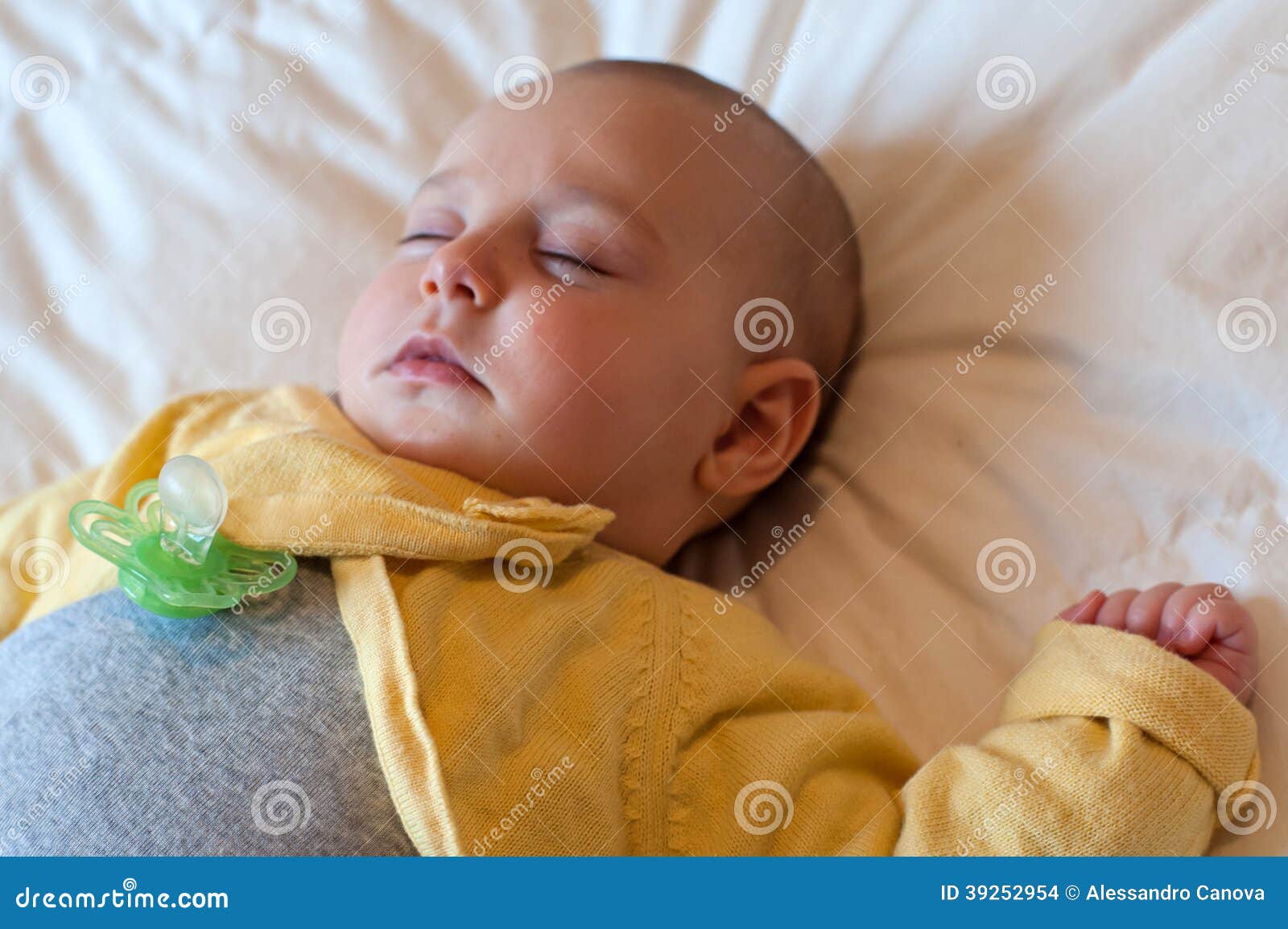 A Baby Sleeps in the Bed with Her Pacifier Stock Photo - Image of ...
