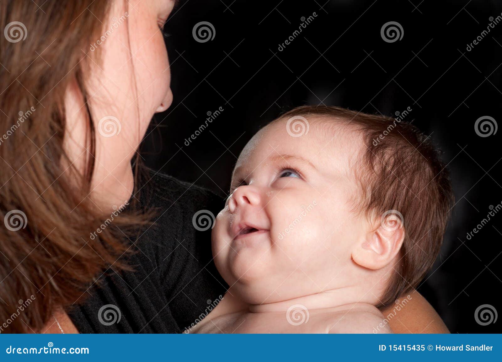 Baby smiles at mother stock image. Image of baby, isolated - 15415435