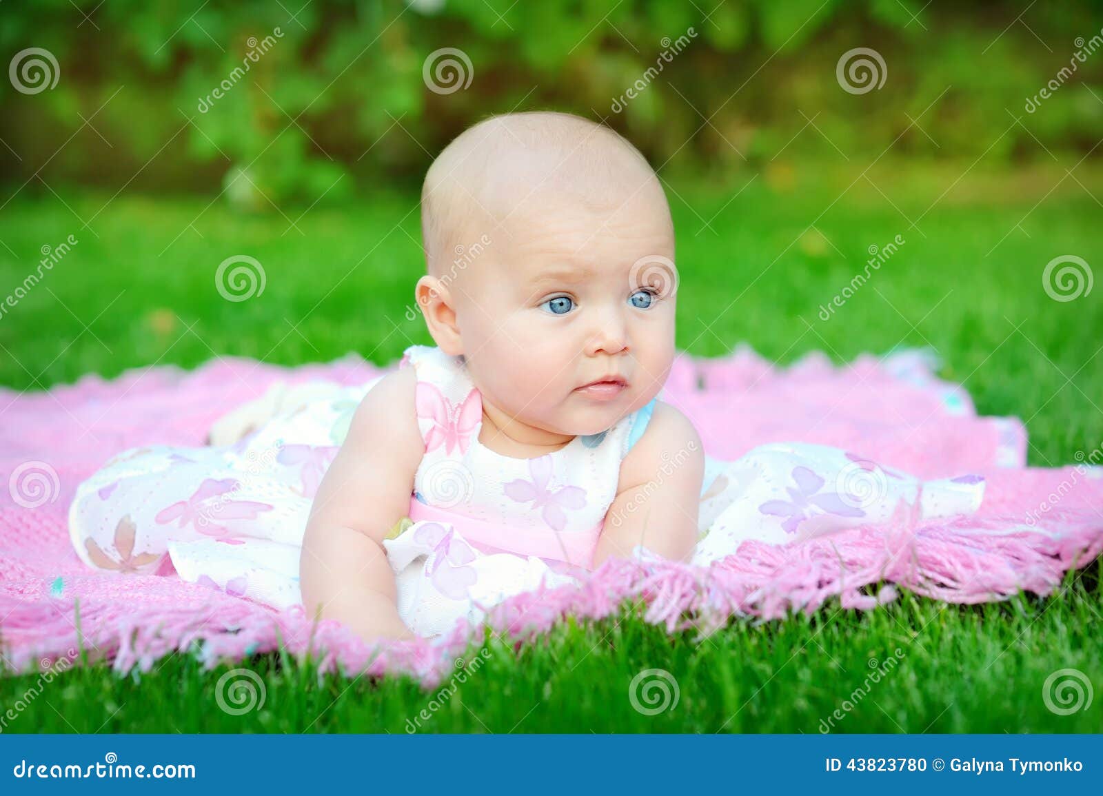 Baby Smiling and Looking Up To Camera Outdoors in Sunlight Stock Photo ...