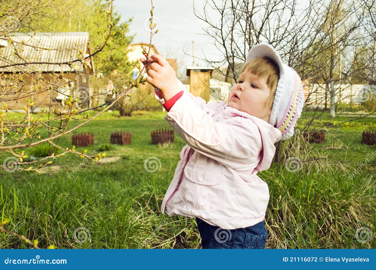 Baby in the spring garden stock photo. Image of play - 21116072