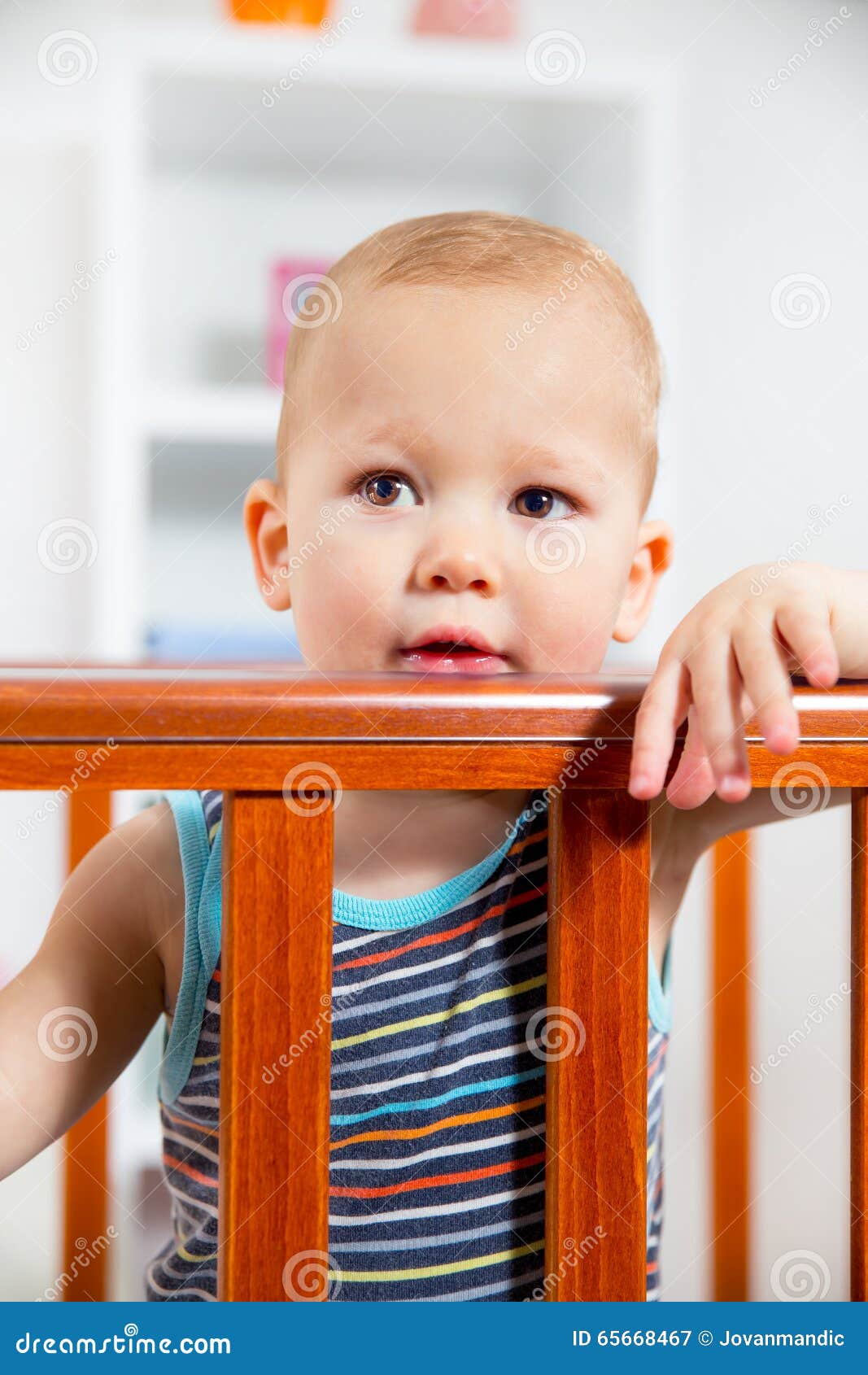 Baby Standing in the Crib stock image. Image of playing - 65668467
