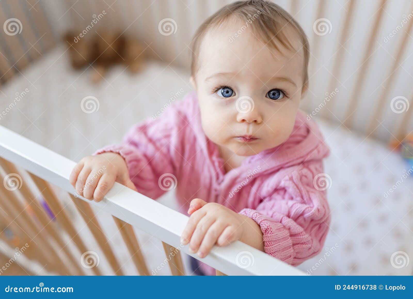 Baby Standing in Crib in the Nursery Stock Photo - Image of childhood ...
