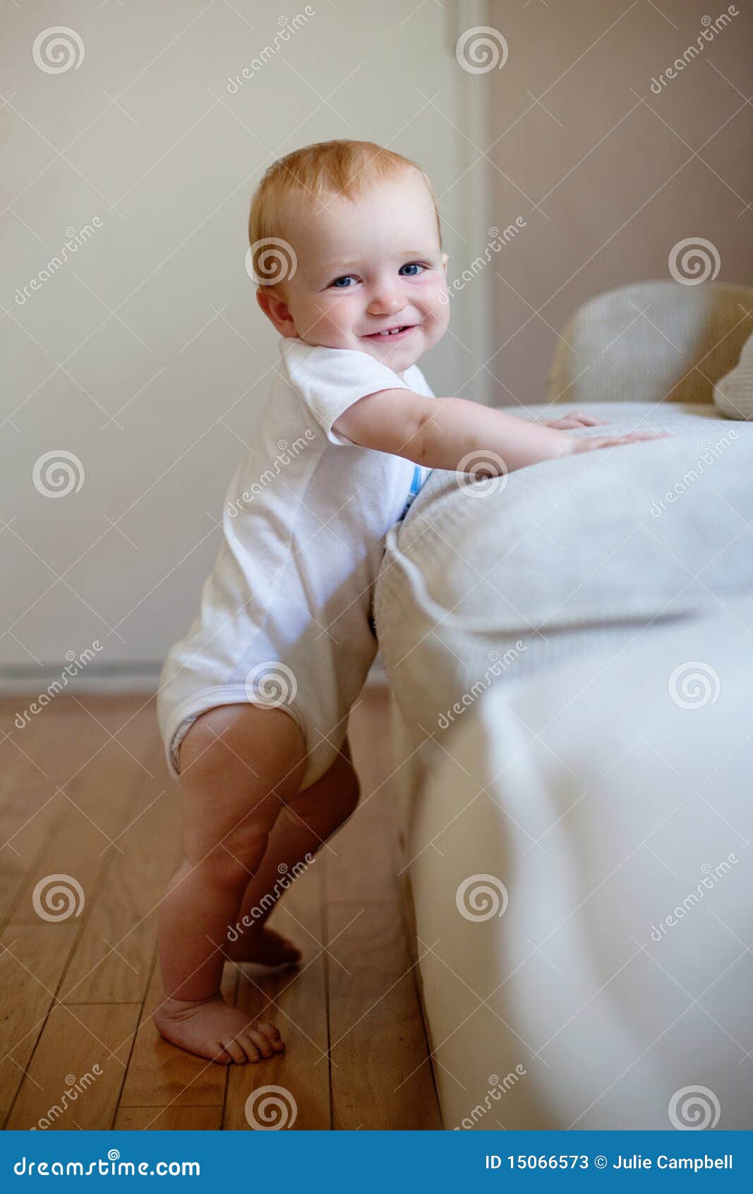 Baby Standing Up Against a Couch Stock Image - Image of happiness ...