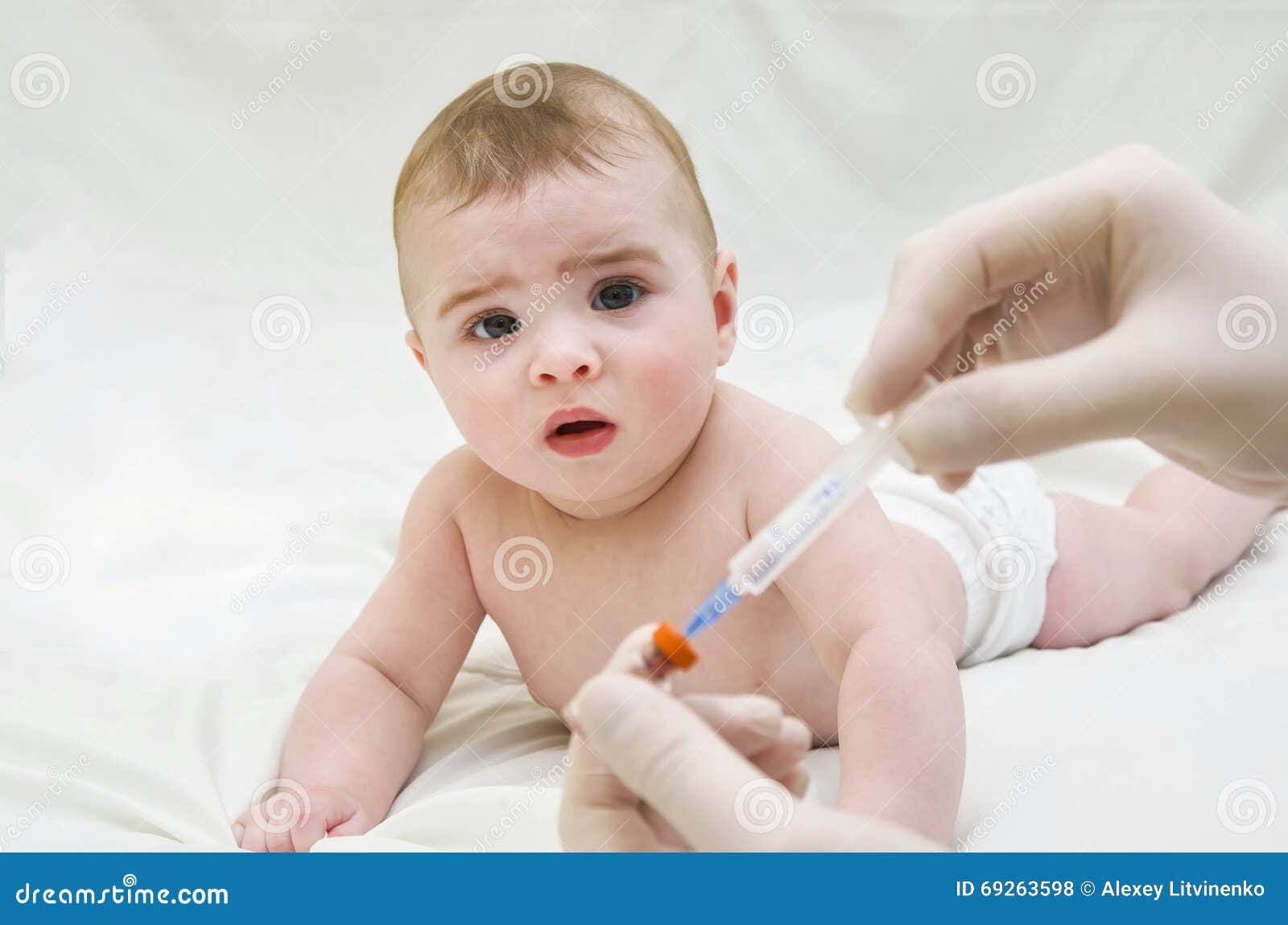 Baby is Starring on Syringe with Immunization Vaccine Stock Photo ...