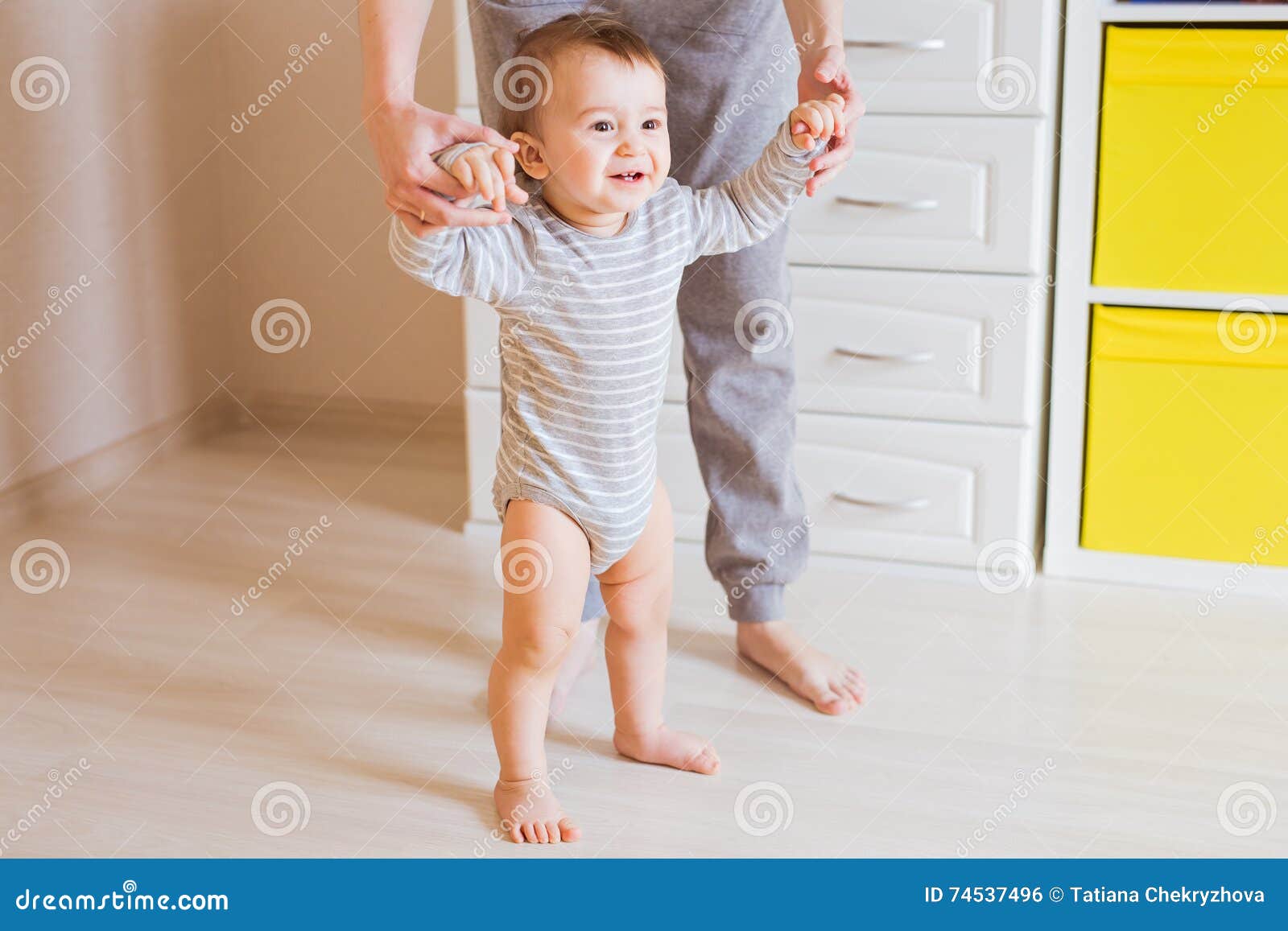Baby Steps with the Help of His Mother Stock Photo - Image of home ...