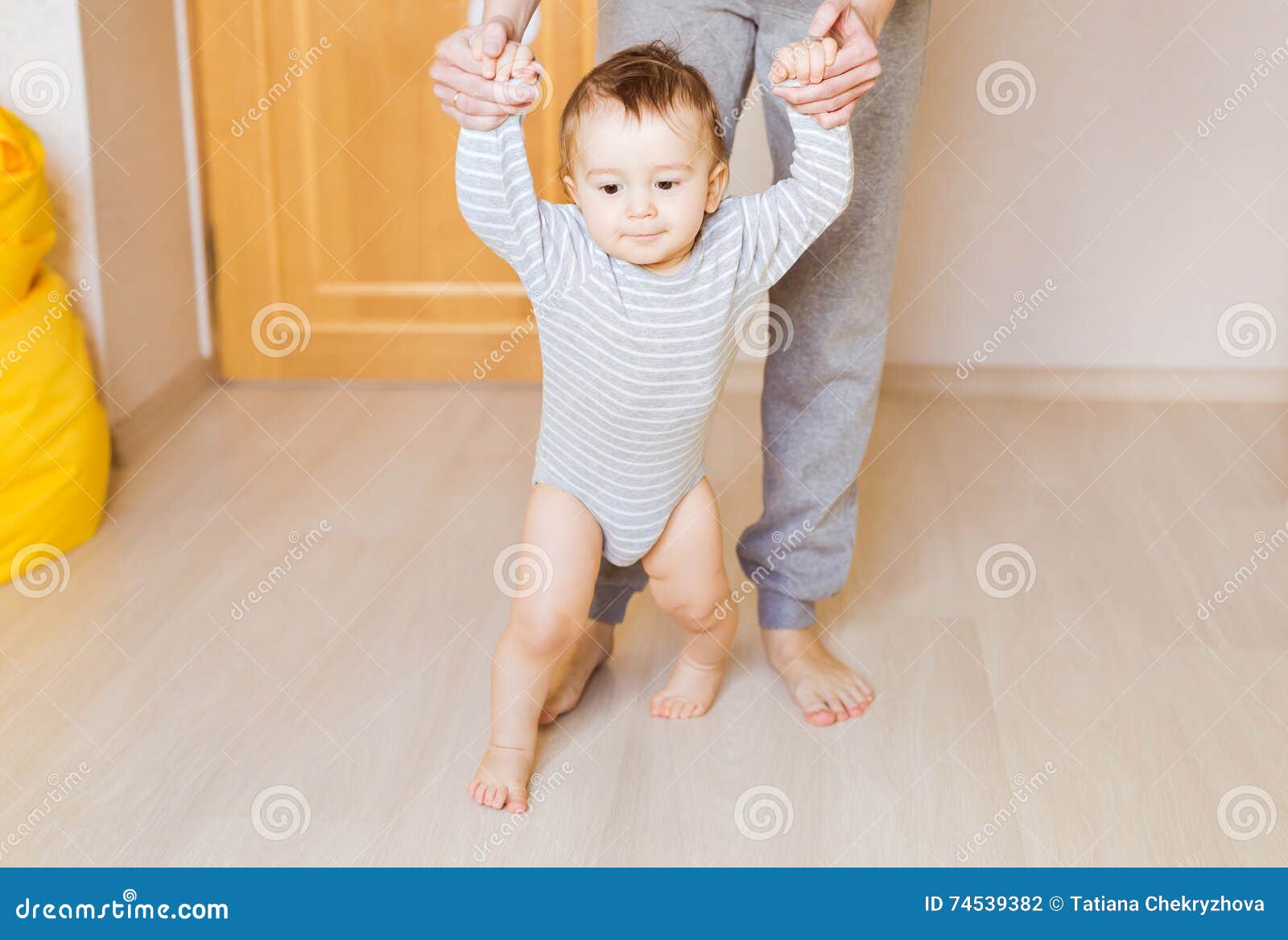 Baby Steps with the Help of His Mother Stock Photo - Image of help ...