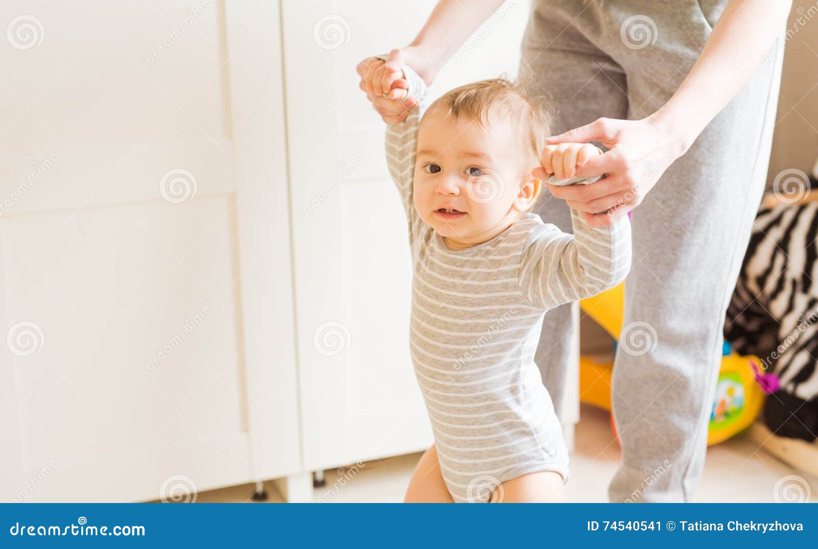 Baby Steps with the Help of His Mother Stock Image - Image of people ...