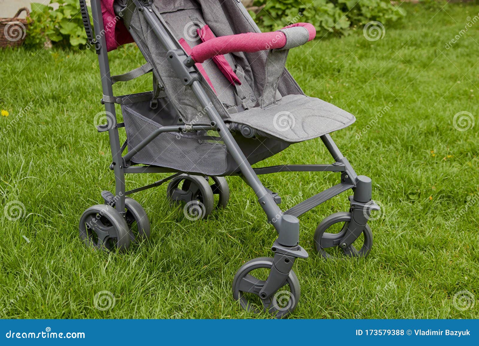 Baby Stroller in the Grass,the Gray Stroller is Empty in the Spring ...
