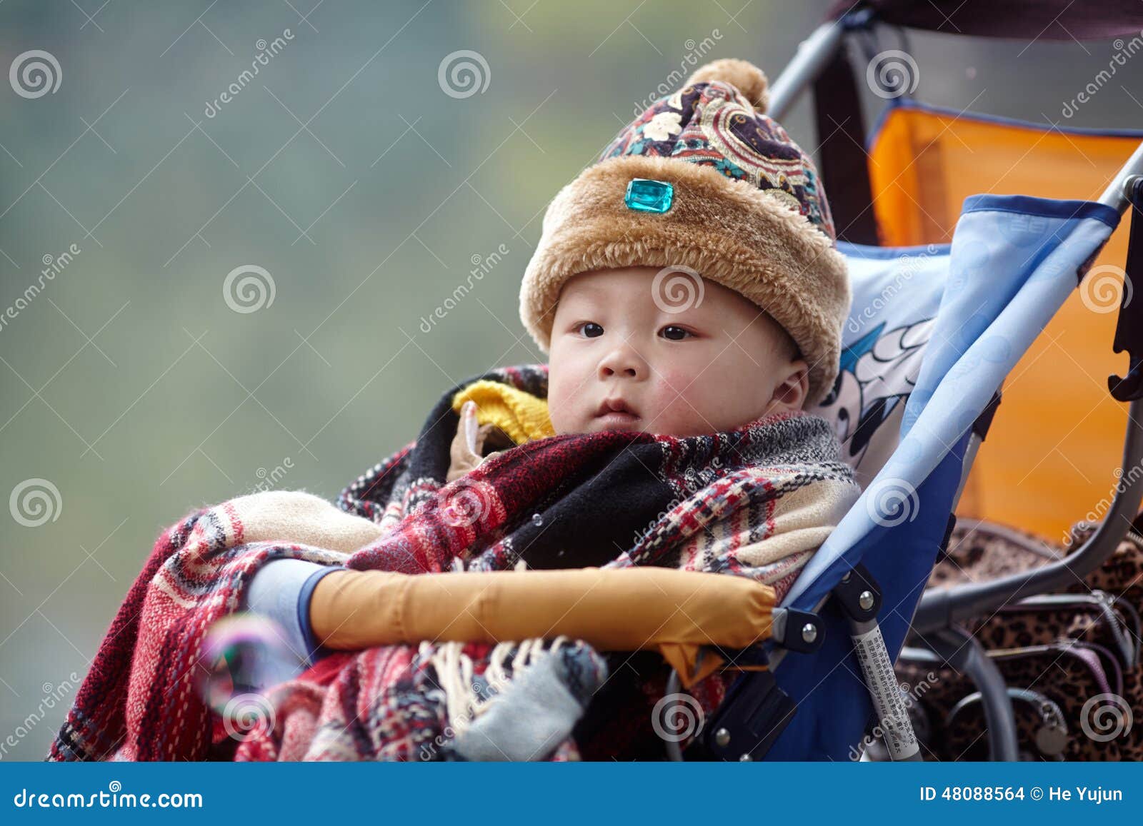 Baby in stroller in winter stock photo. Image of active - 48088564