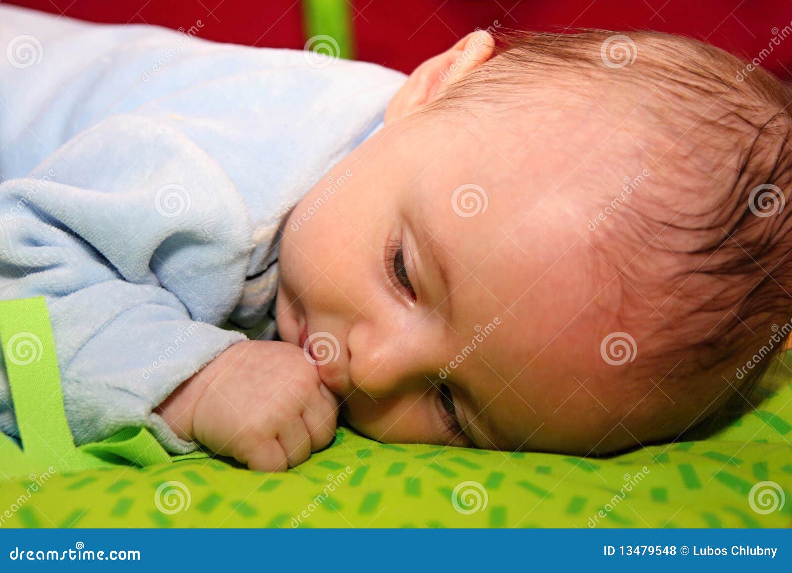 Baby sucks the thumb stock photo. Image of babe, infant - 13479548