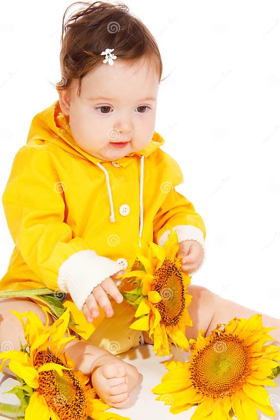 Baby with sunflowers stock image. Image of innocence - 10729539