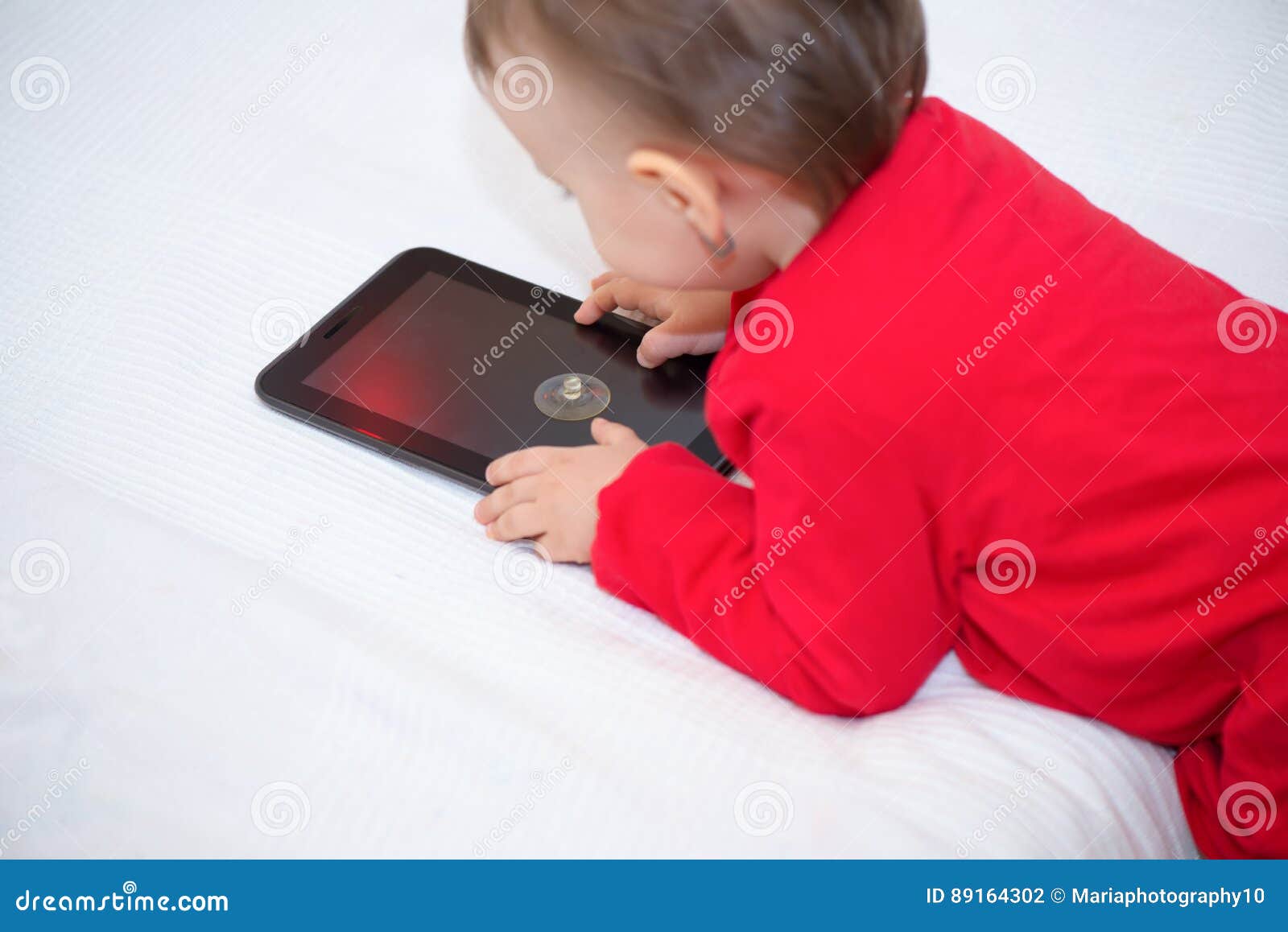 Baby with tablet stock photo. Image of cute, technology - 89164302