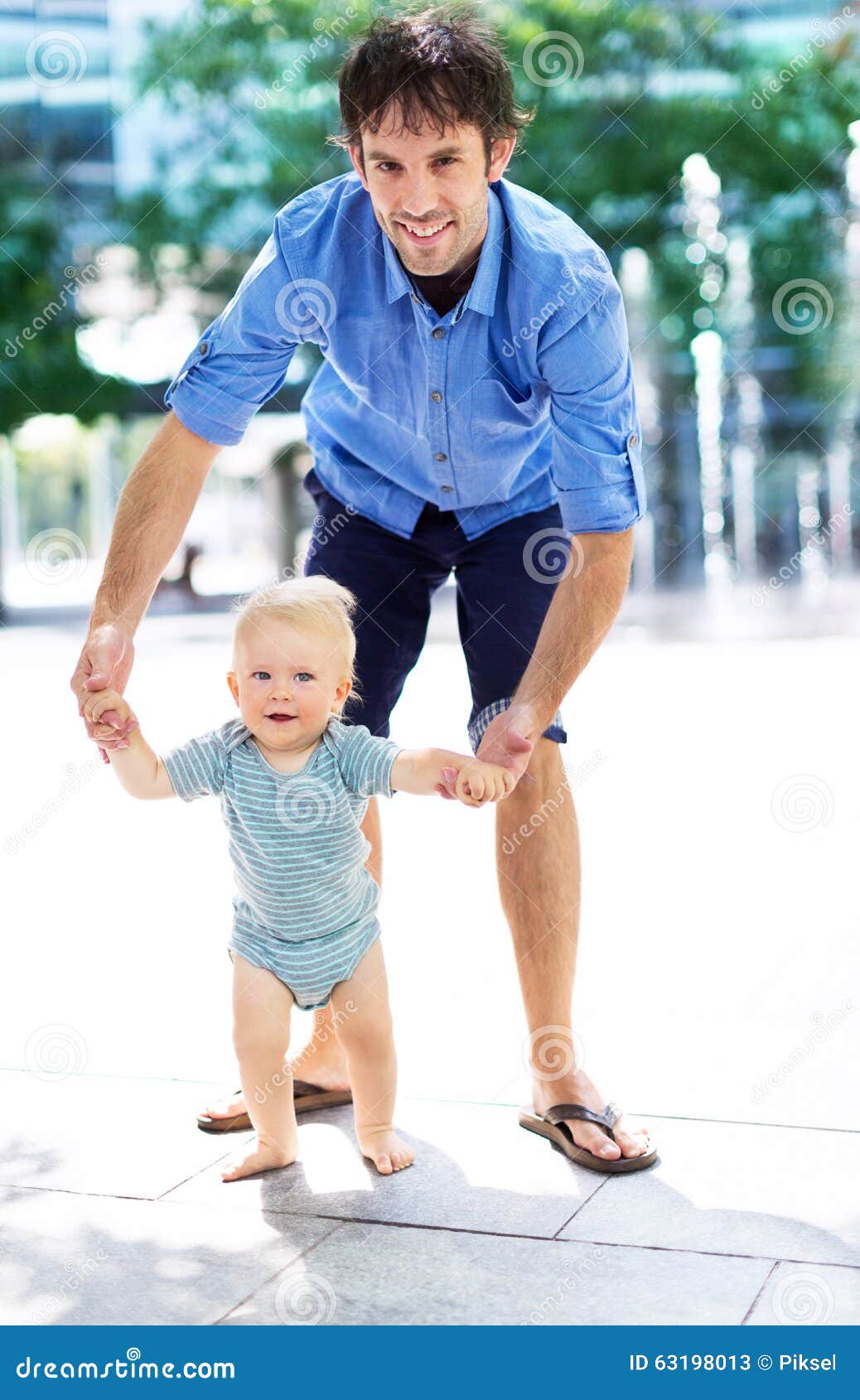 Baby Taking First Steps with Fathers Help Stock Image - Image of happy ...