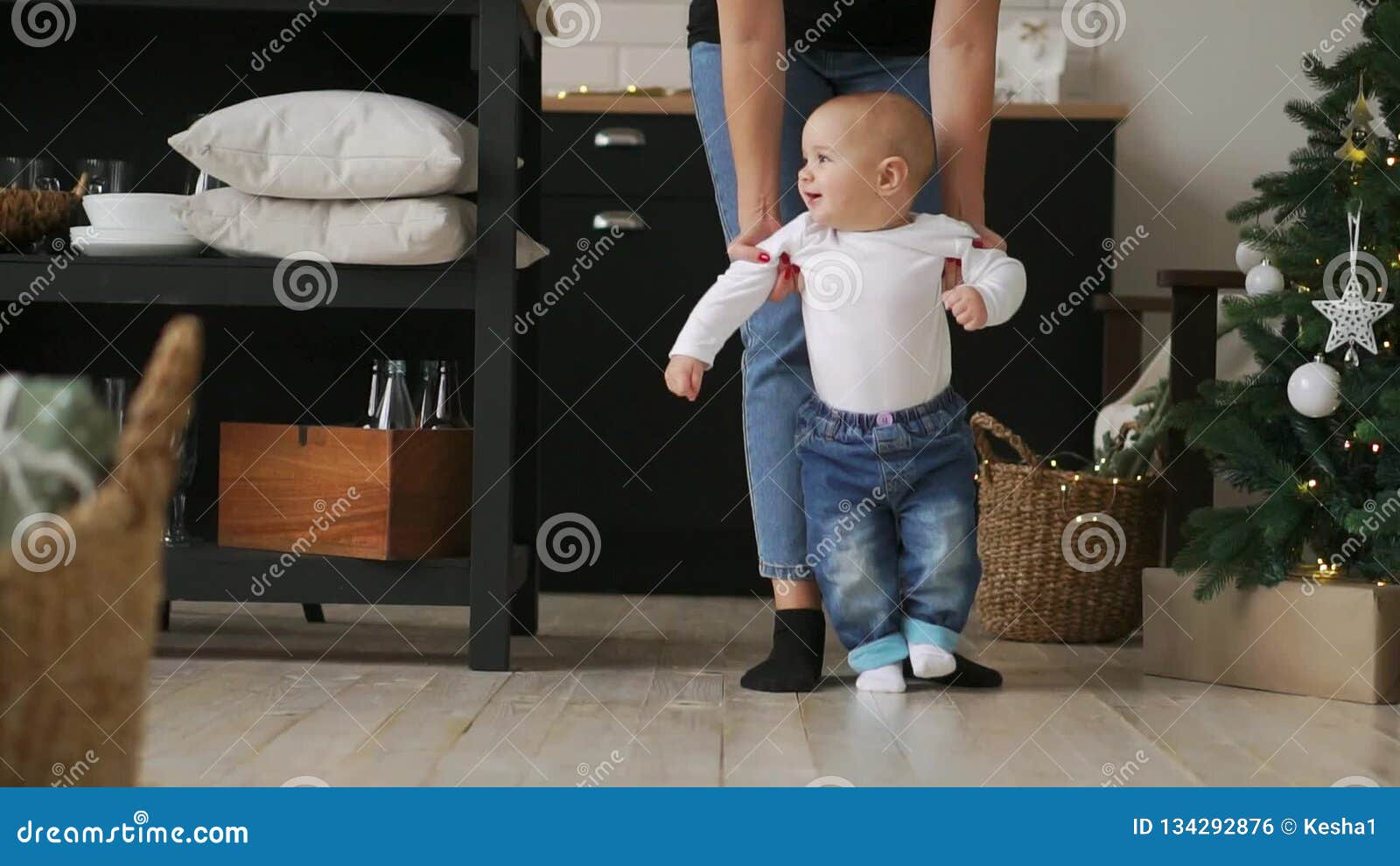 Baby Taking First Steps with Mother Help Stock Footage - Video of ...