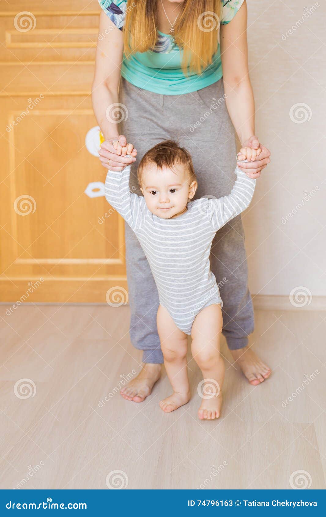 Baby Taking First Steps with Mother Help Stock Image - Image of life ...