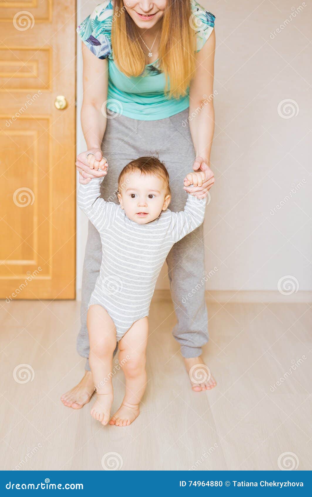 Baby Taking First Steps with Mother Help Stock Photo - Image of love ...